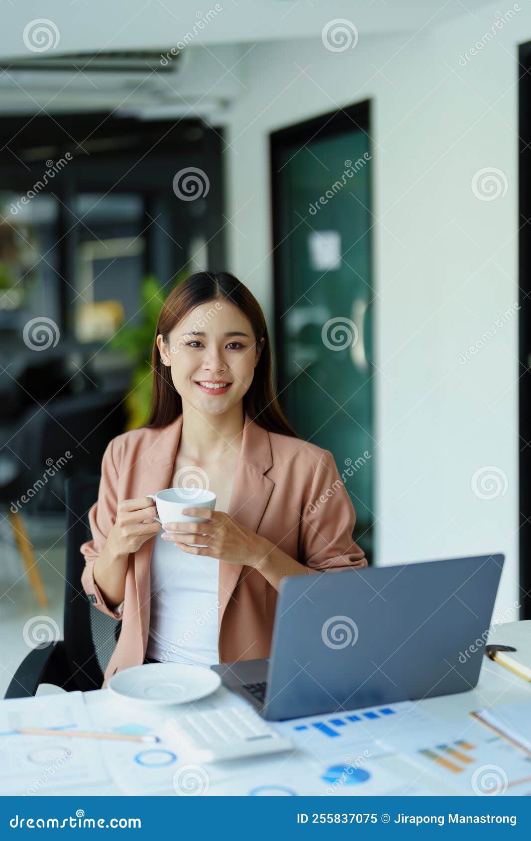 Portrait of a Woman Taking a Coffee Break while Using a Computer. Stock ...