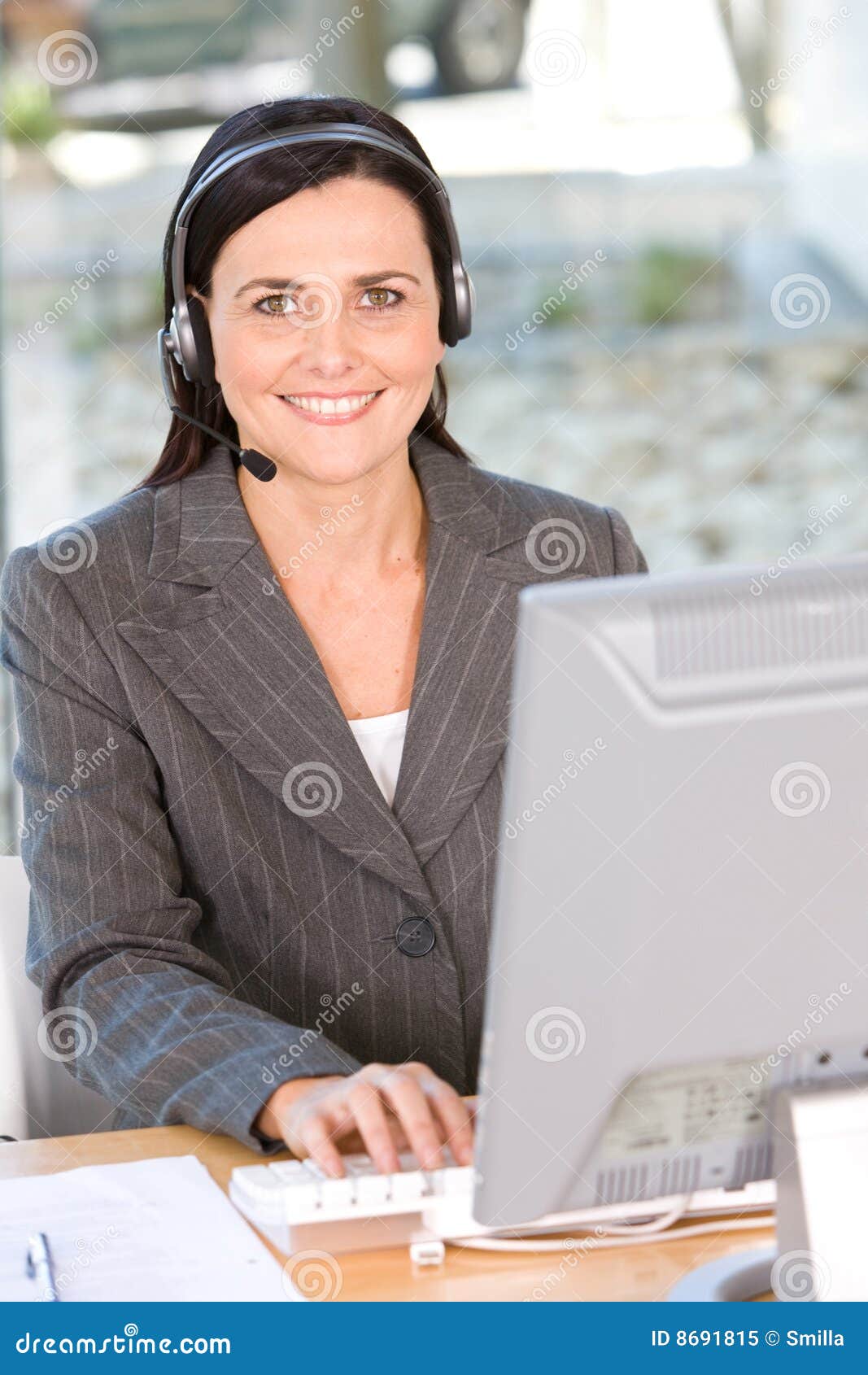 Portrait of Woman Wearing Headset Using Computer Stock Image - Image of ...