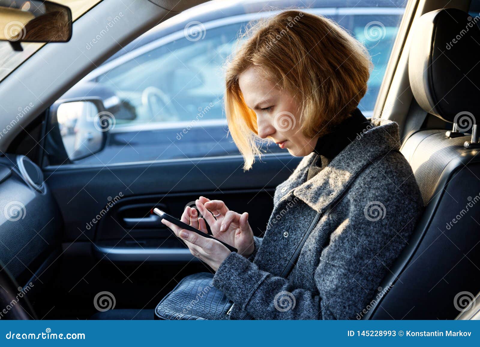 Woman Using Smartphone in Car Stock Image - Image of casual ...