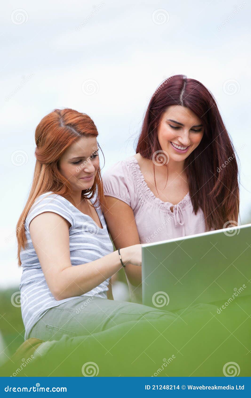 Portrait of Women Using a Notebook Stock Photo - Image of grass ...