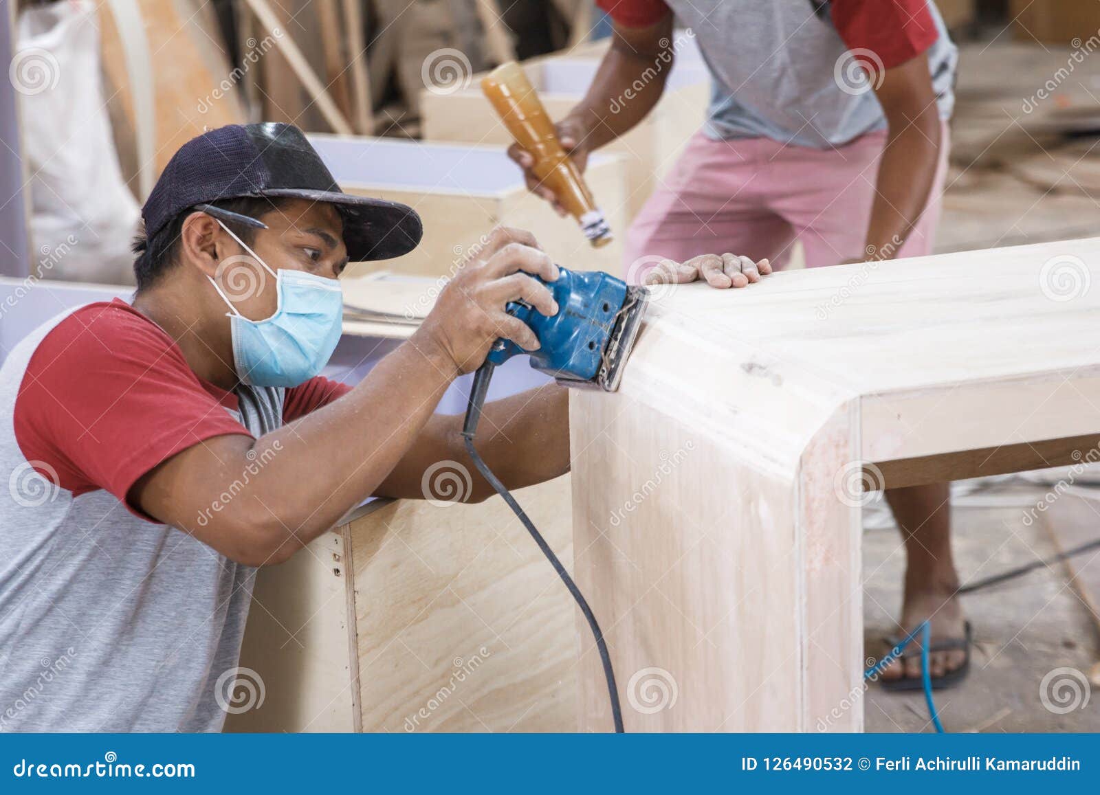 Worker at Carpenter Workspace Refining the Surface of Wood Board Stock ...