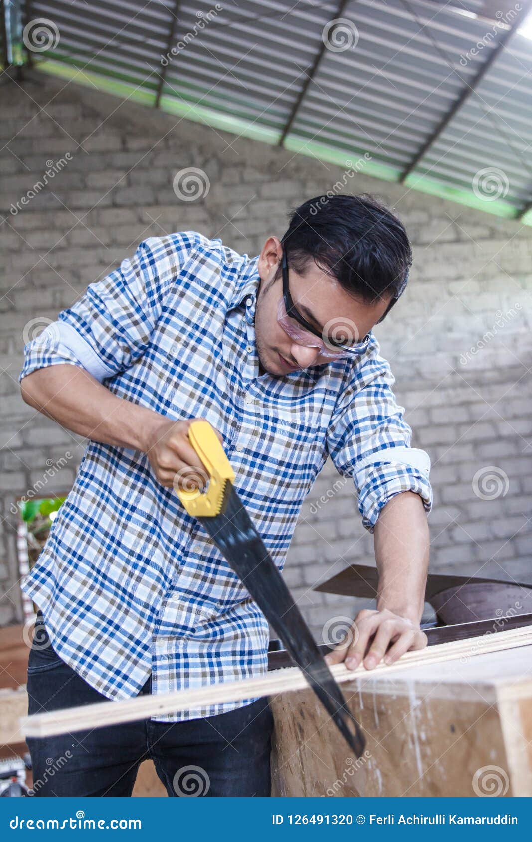 Worker Cutting the Wood Board Using Saw Stock Photo - Image of ...