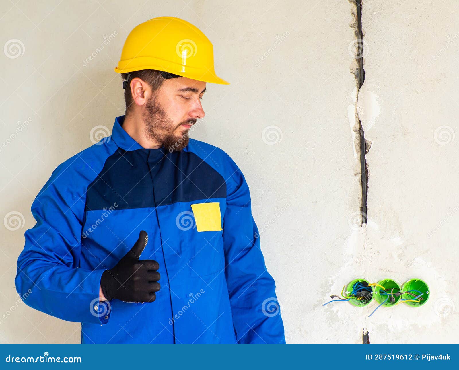 Portrait of Worker or Engineer in Blue Work Clothes and Yellow Safety ...
