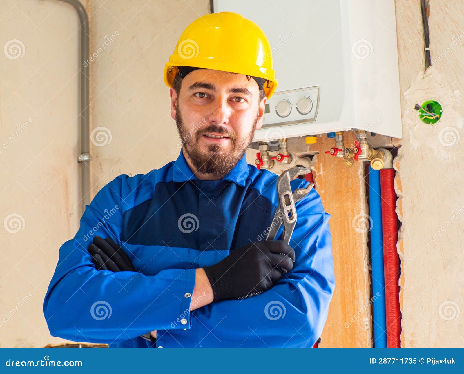 Portrait of Worker or Engineer in Blue Work Clothes and Yellow Safety ...