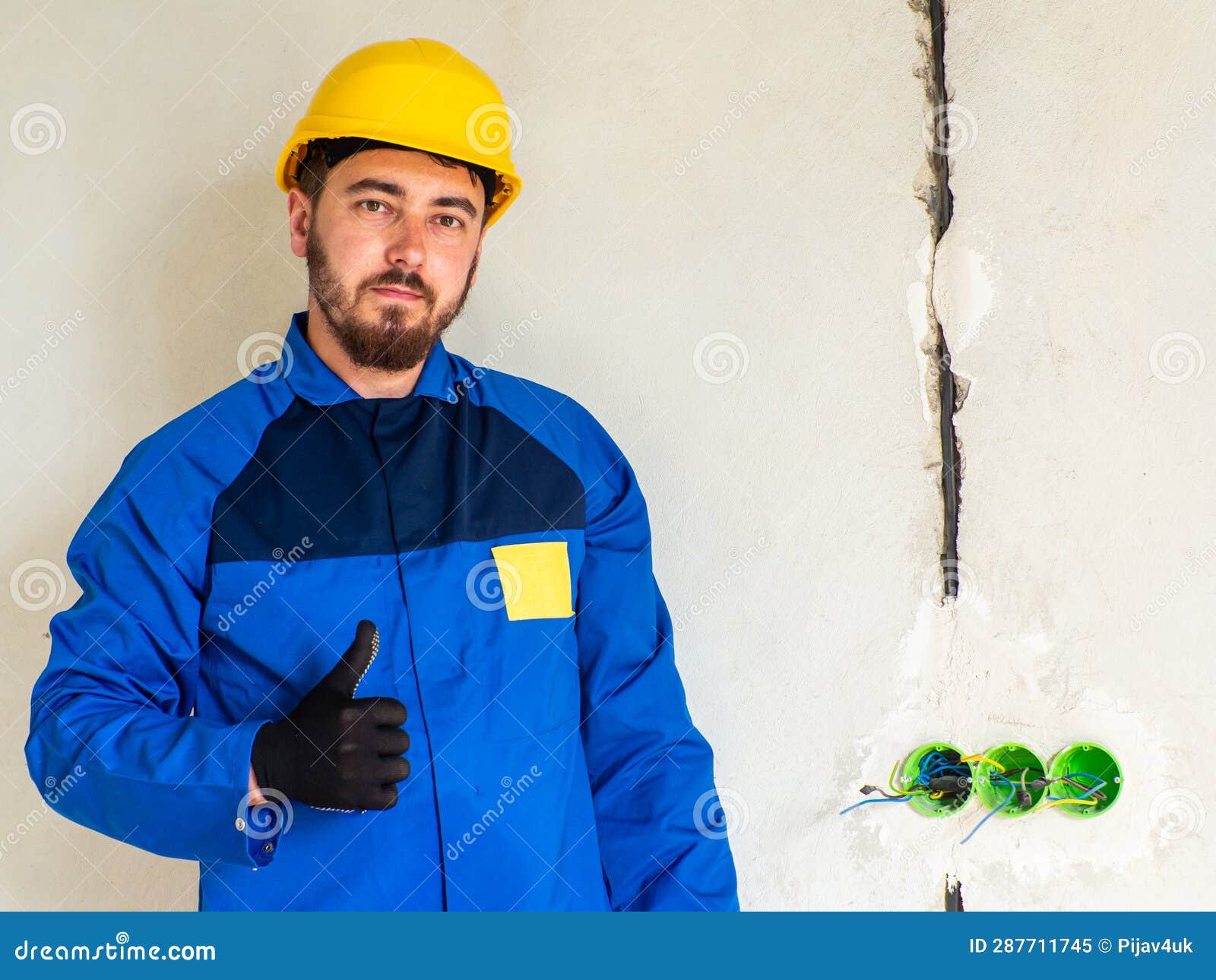 Portrait of Worker or Engineer in Blue Work Clothes and Yellow Safety ...
