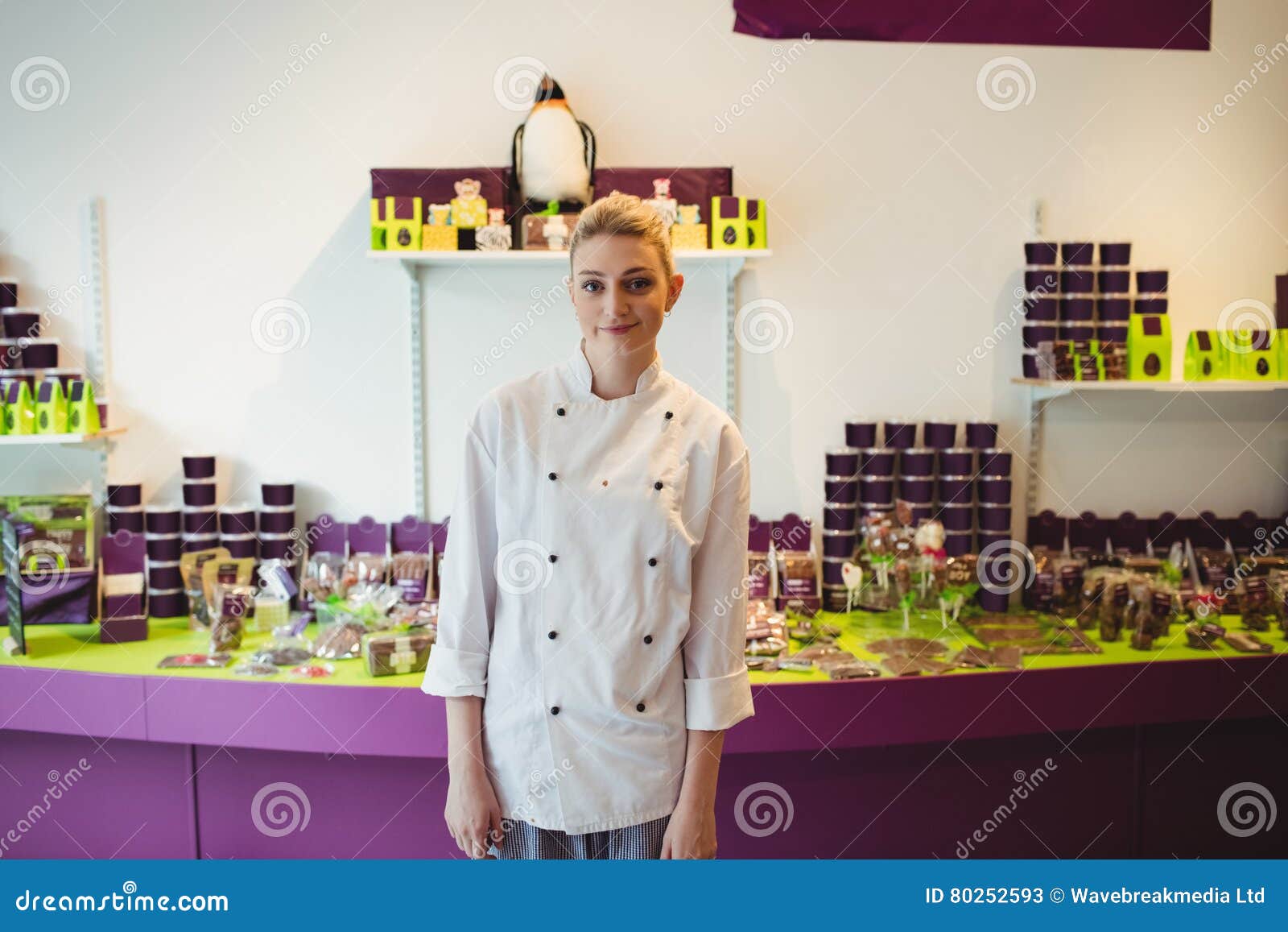 Portrait of Worker Standing Next To Chocolate Display Stock Image ...