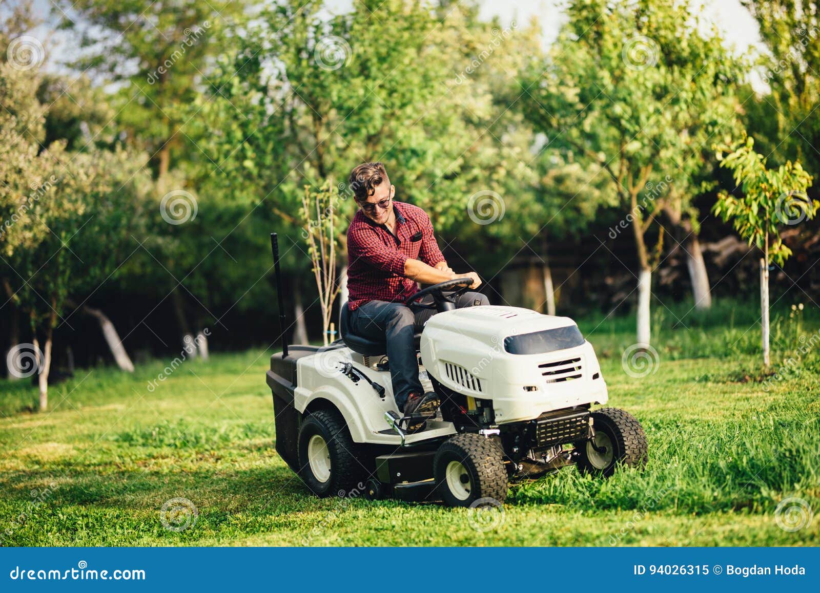 Portrait of Worker Using Lawn Mower for Cutting Grass Stock Image ...