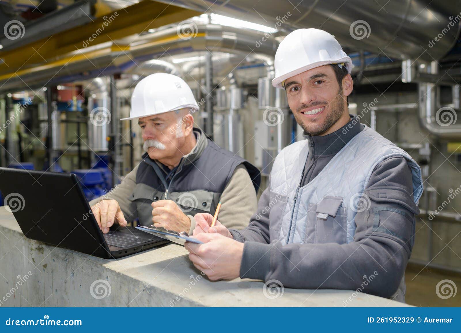 Portrait workers on plant stock image. Image of system - 261952329