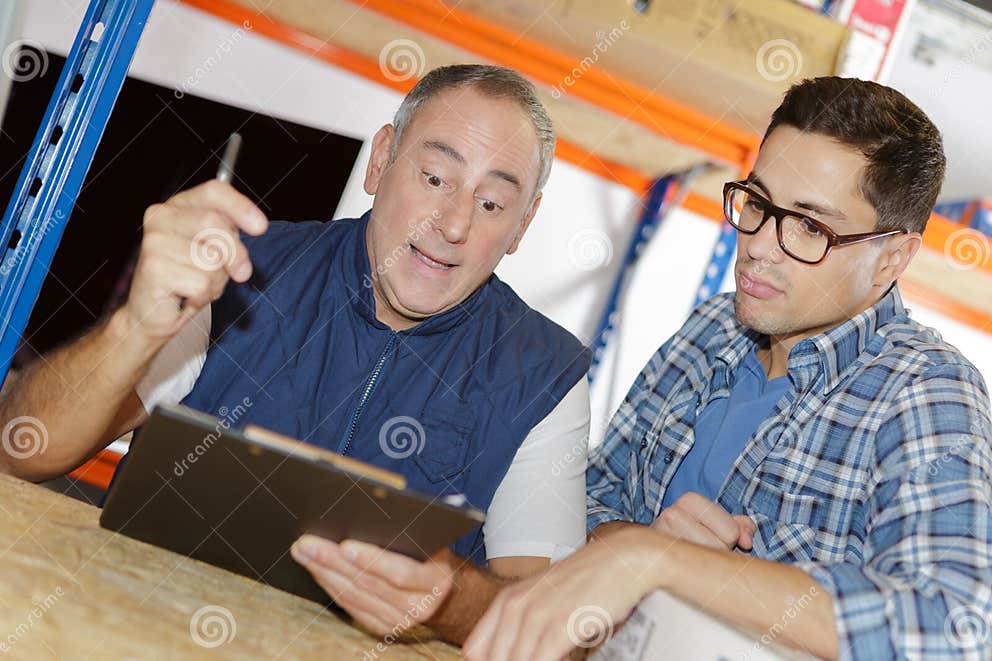 Portrait Workers Rechecking List Stock Image - Image of recording ...