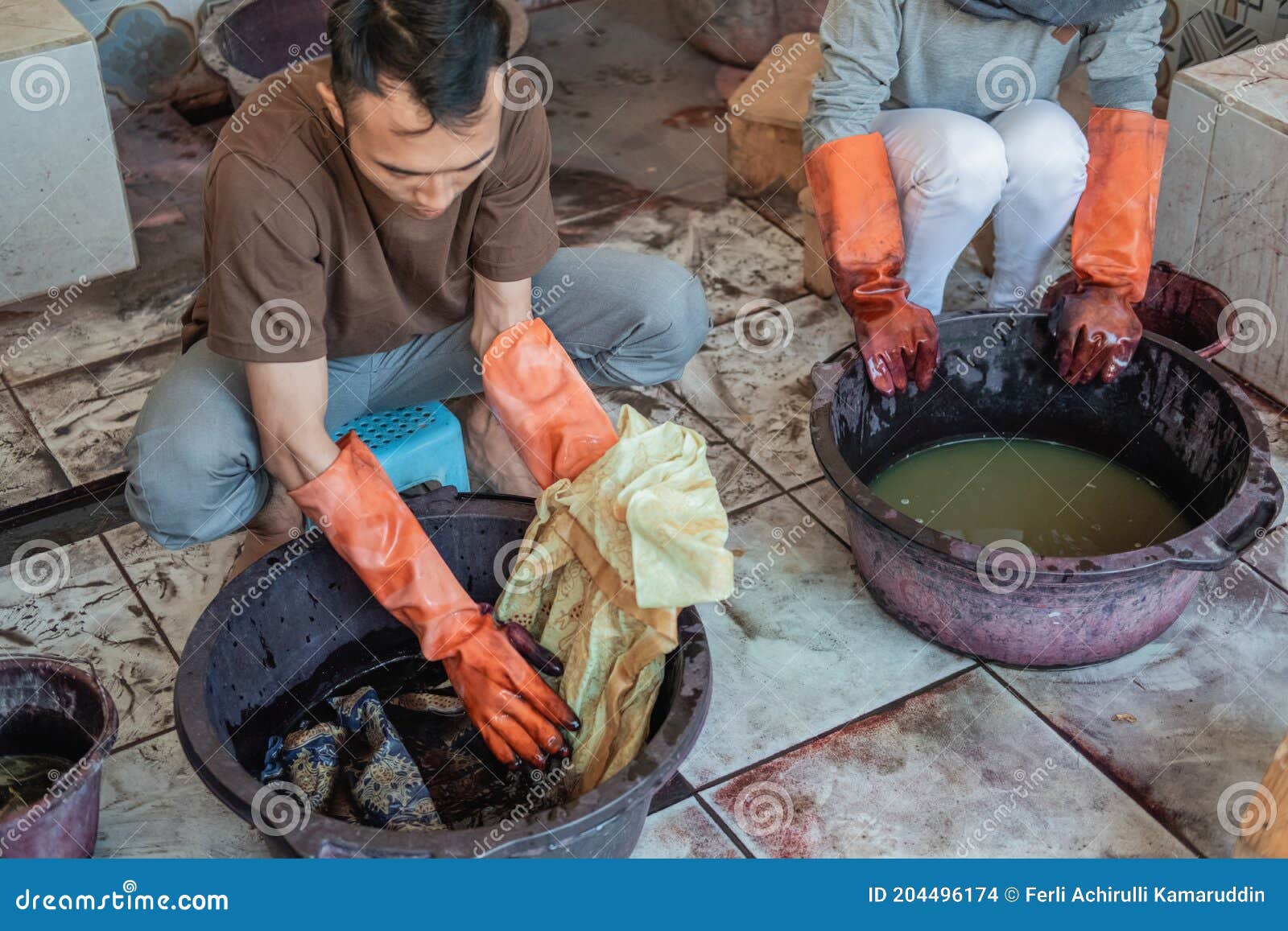 A Portrait of a Workers Work in Cloth Coloring Process Stock Photo ...
