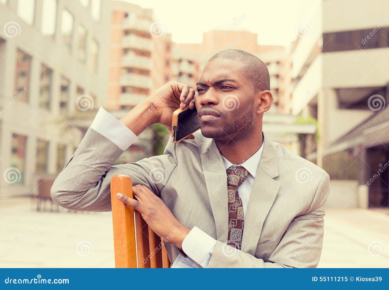 Portrait Worried Man Talking On Mobile Phone Outdoors Stock Image