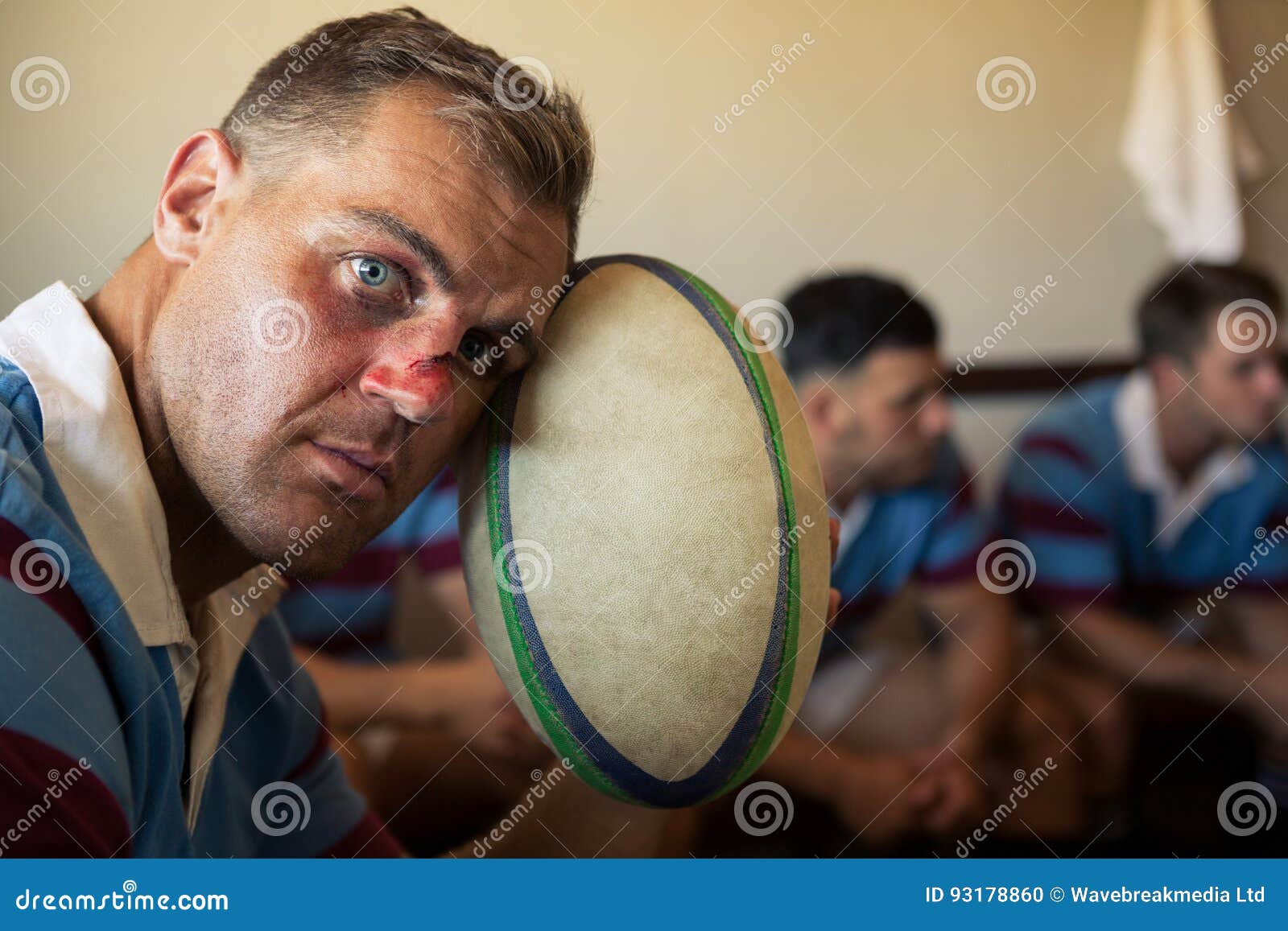 Portrait of Wounded Player Sitting with Team Stock Photo - Image of ...