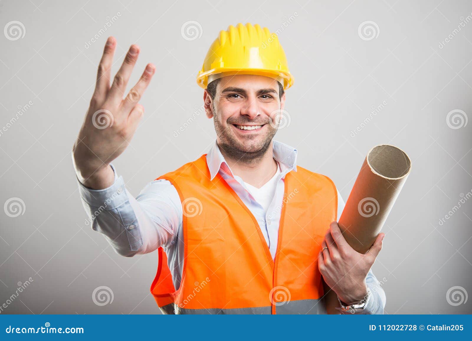 Portrait of Young Architect Holding Blueprints Showing Number Th Stock ... Portrait of Young Architect Holding Blueprints Showing Number Th Stock ...