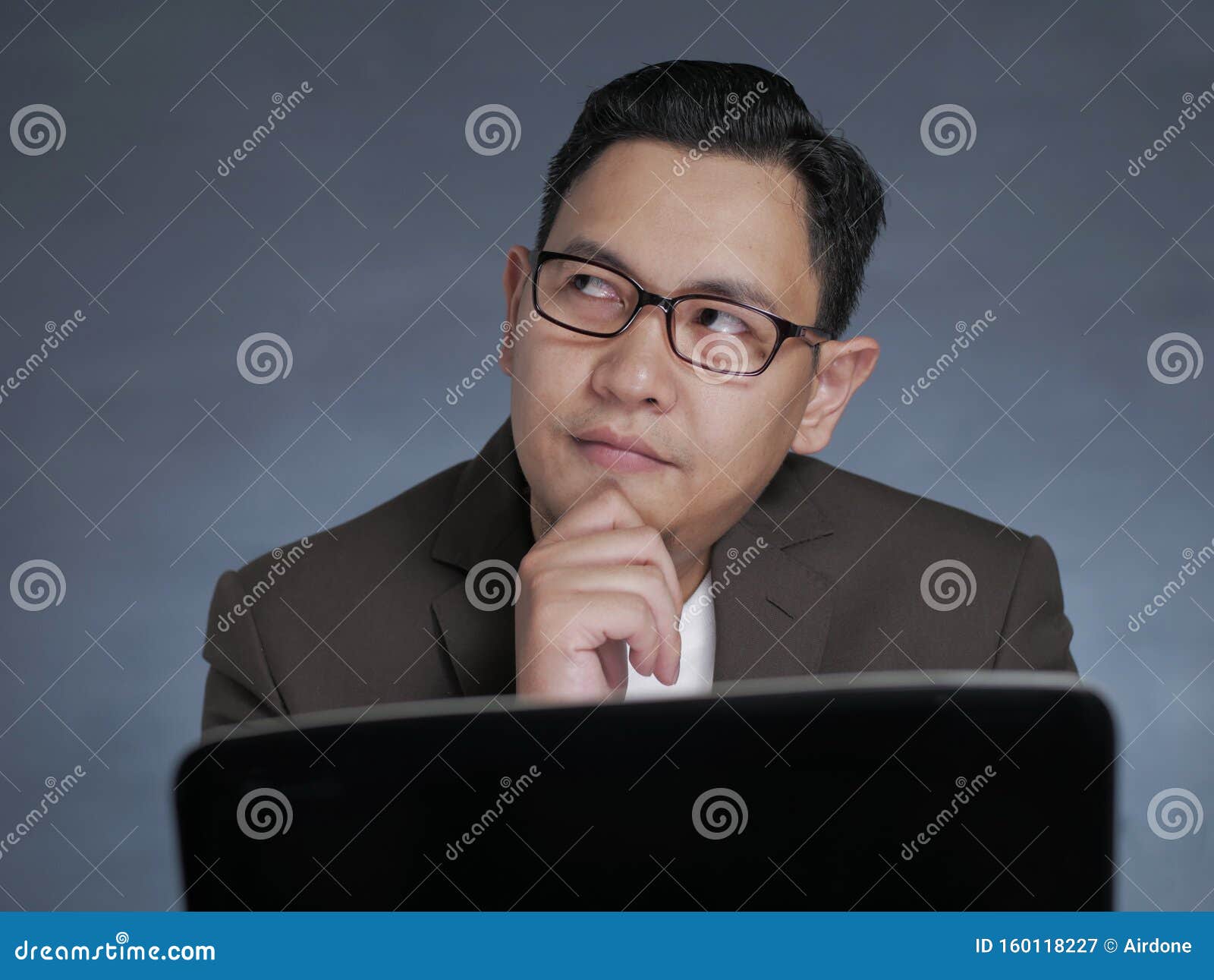 Young Man with Laptop, Thinking Seriously Stock Image - Image of male ...