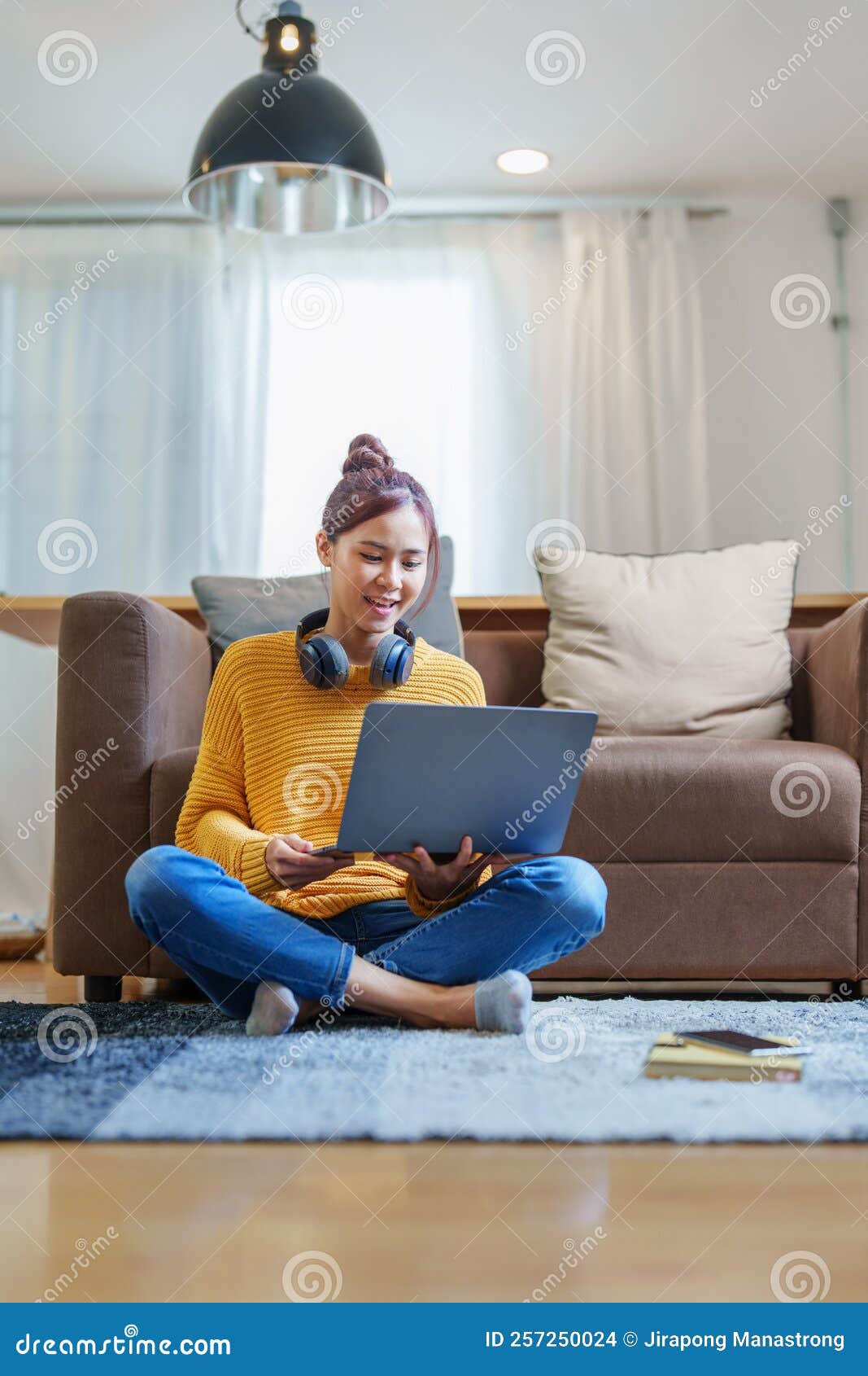 Portrait of a Young Asian Woman Using a Computer on the Sofa Stock ...