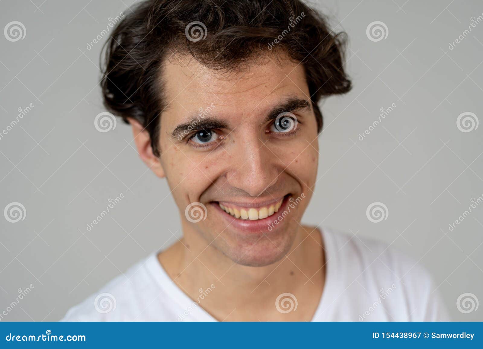 Portrait Of Young Attractive Cheerful Man With Smiling Happy Face