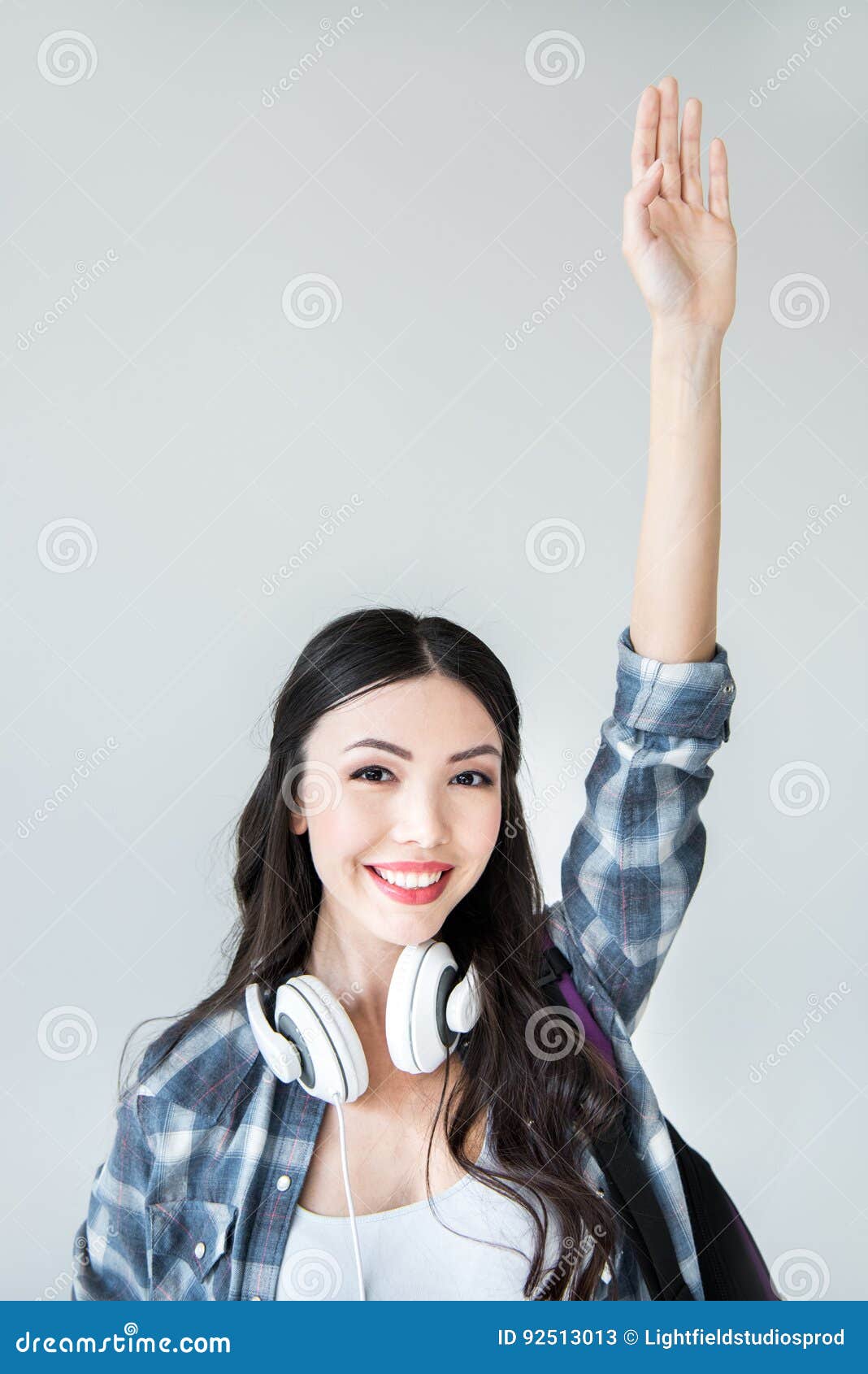 Portrait of Young Attractive Man with Raising Hand in Studio Stock ...