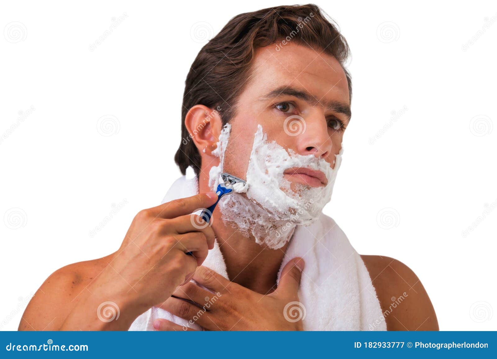 Portrait of Young Attractive Man Shaving His Beard while Looking in the ... Portrait of Young Attractive Man Shaving His Beard while Looking in the ...