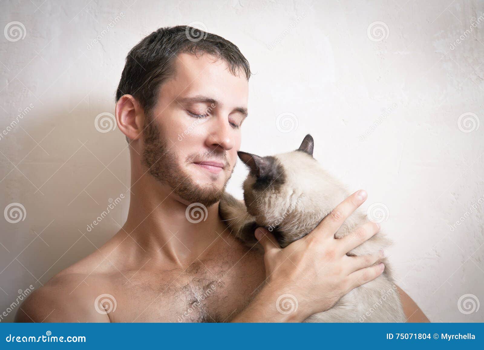 Portrait of a Young Attractive Smiling Man with Cat in Hands Stock ...