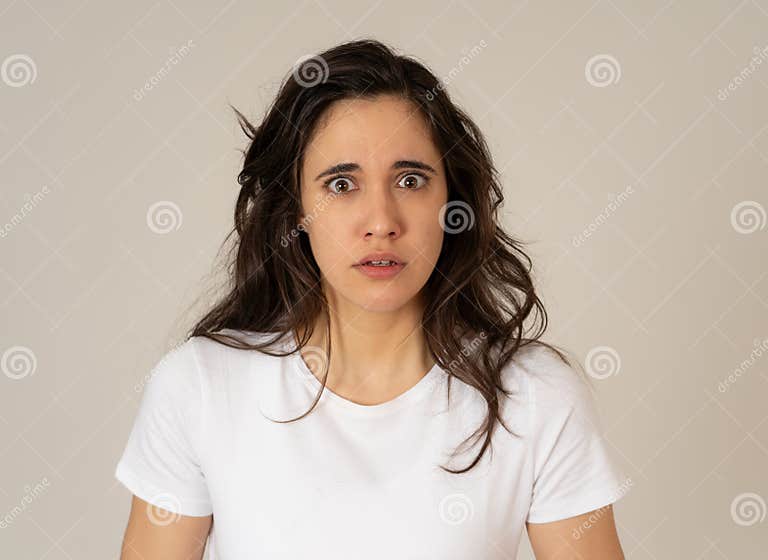 Portrait Of A Young Attractive Woman Looking Scared And Shocked Human