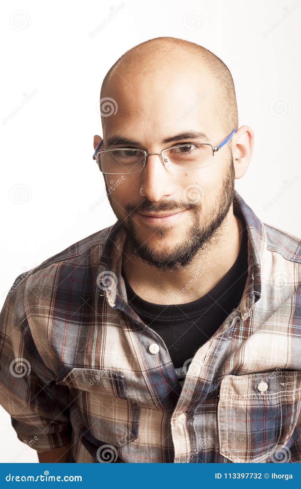 Young Bald Man Standing Shirtless Smiling Doing Phone Gesture With Hand