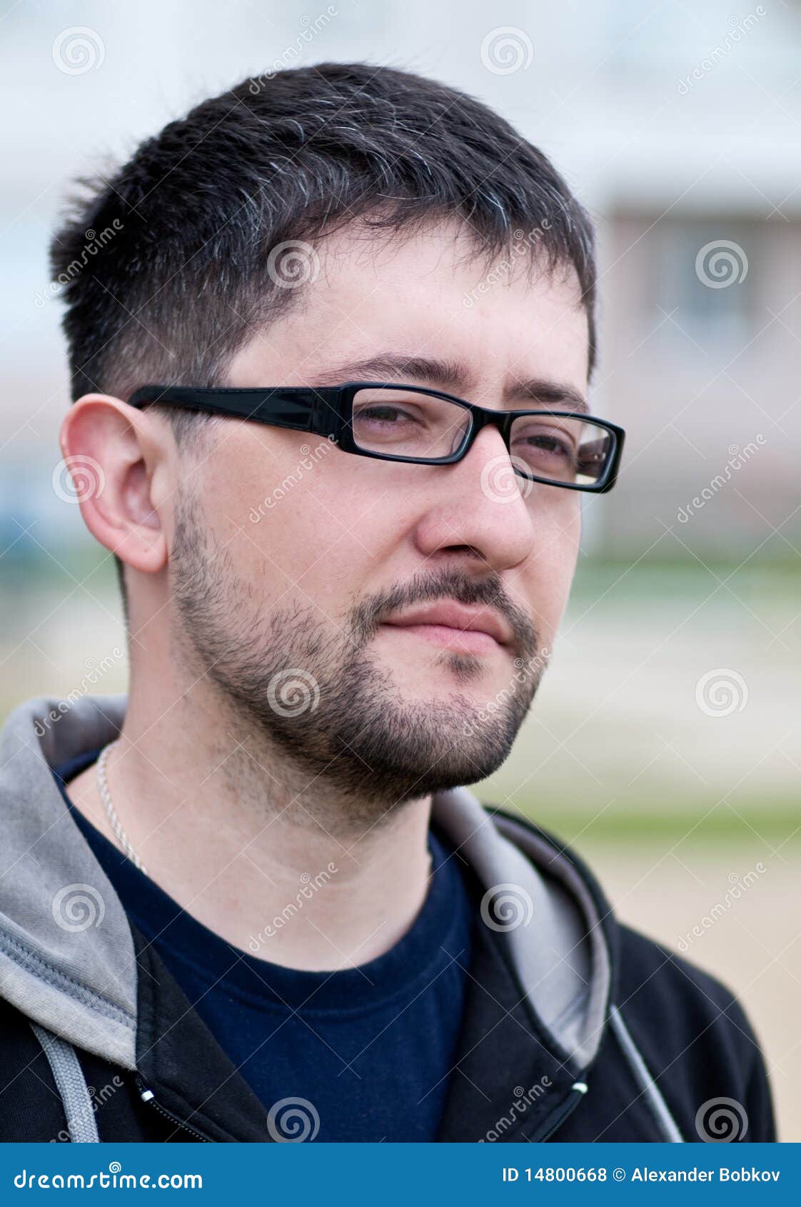 Portrait of a Young Bearded Man Wearing Glasses Stock Photo - Image of ...