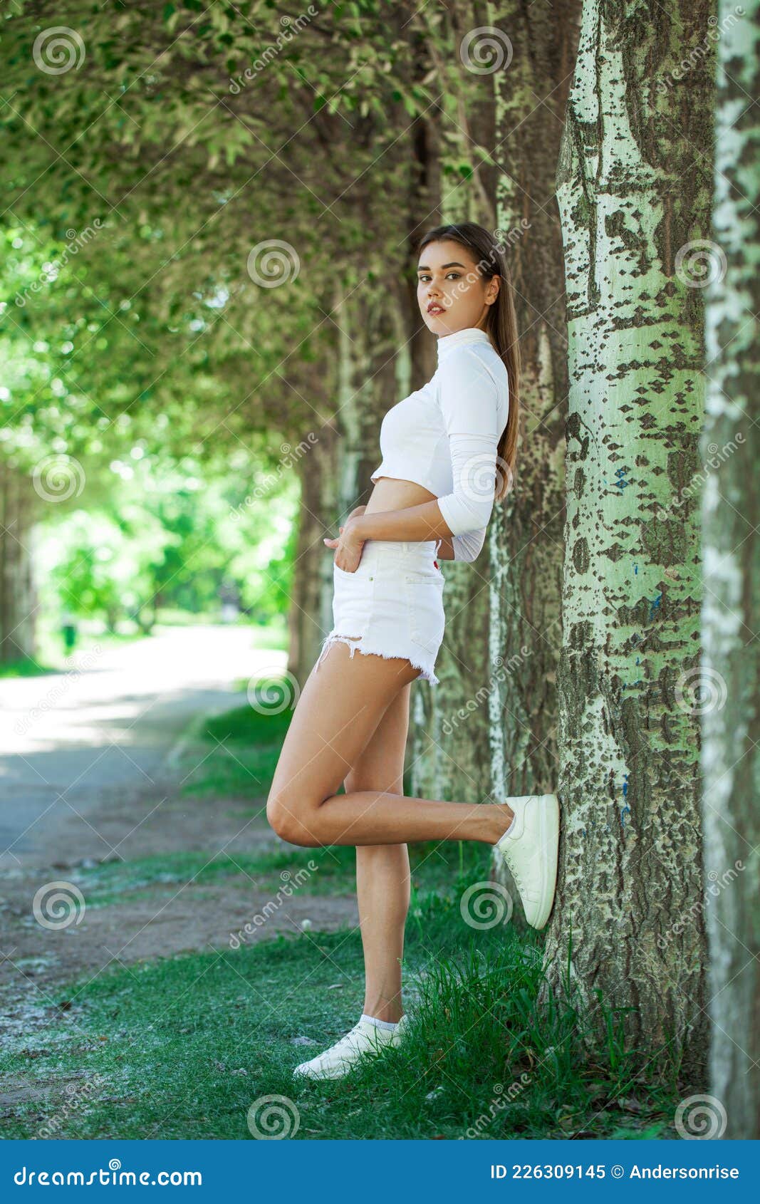 Portrait Of A Young Beautiful Brunette Woman In White Denim Shorts Stock Image Image Of