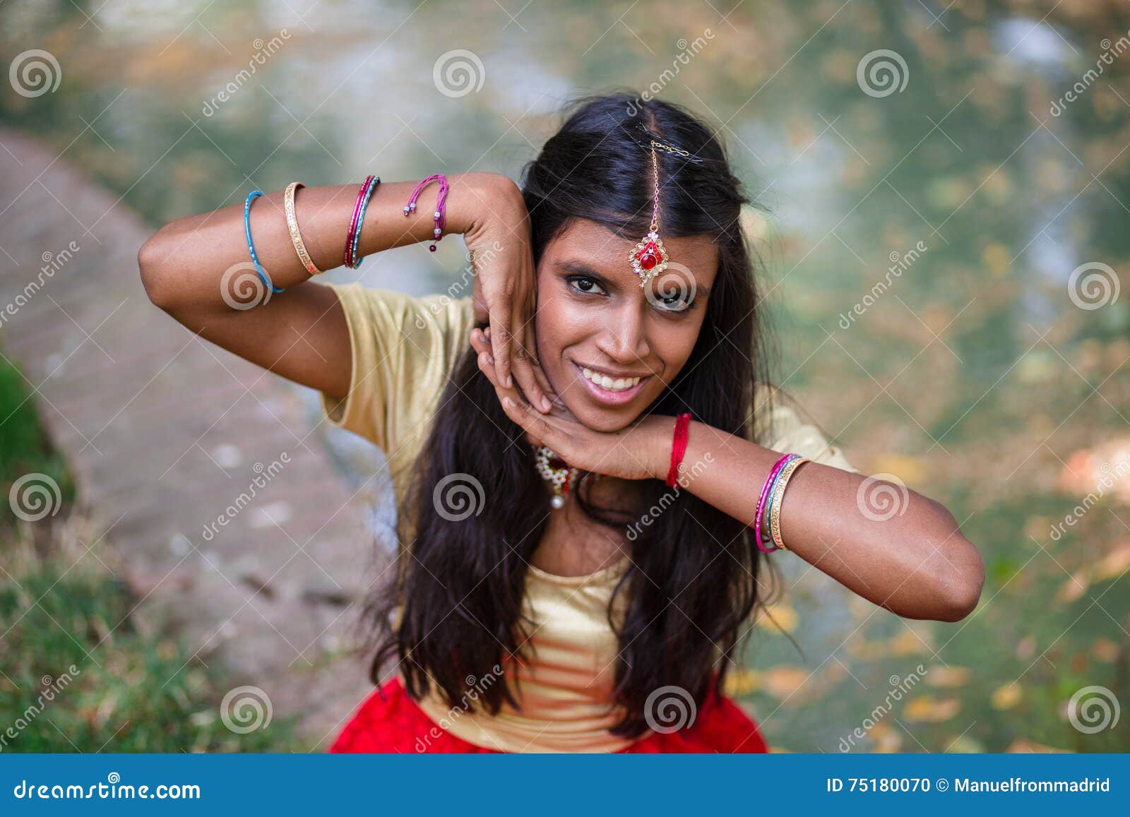 Portrait Of A Young Beautiful Cheerful Traditional Indian Woman Stock