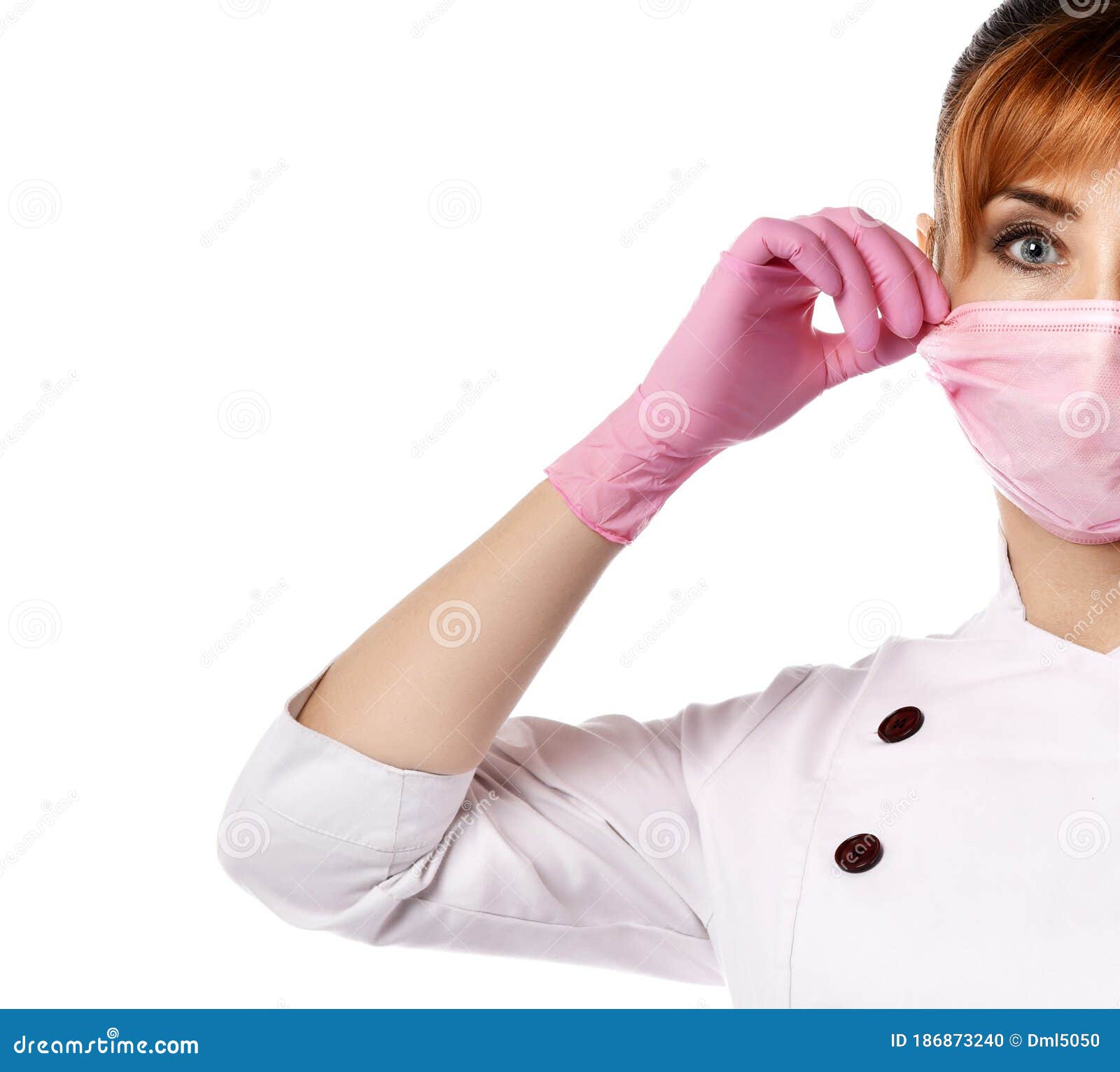 Portrait Of Young Beautiful Red Haired Woman Doctor Or Nurse In White