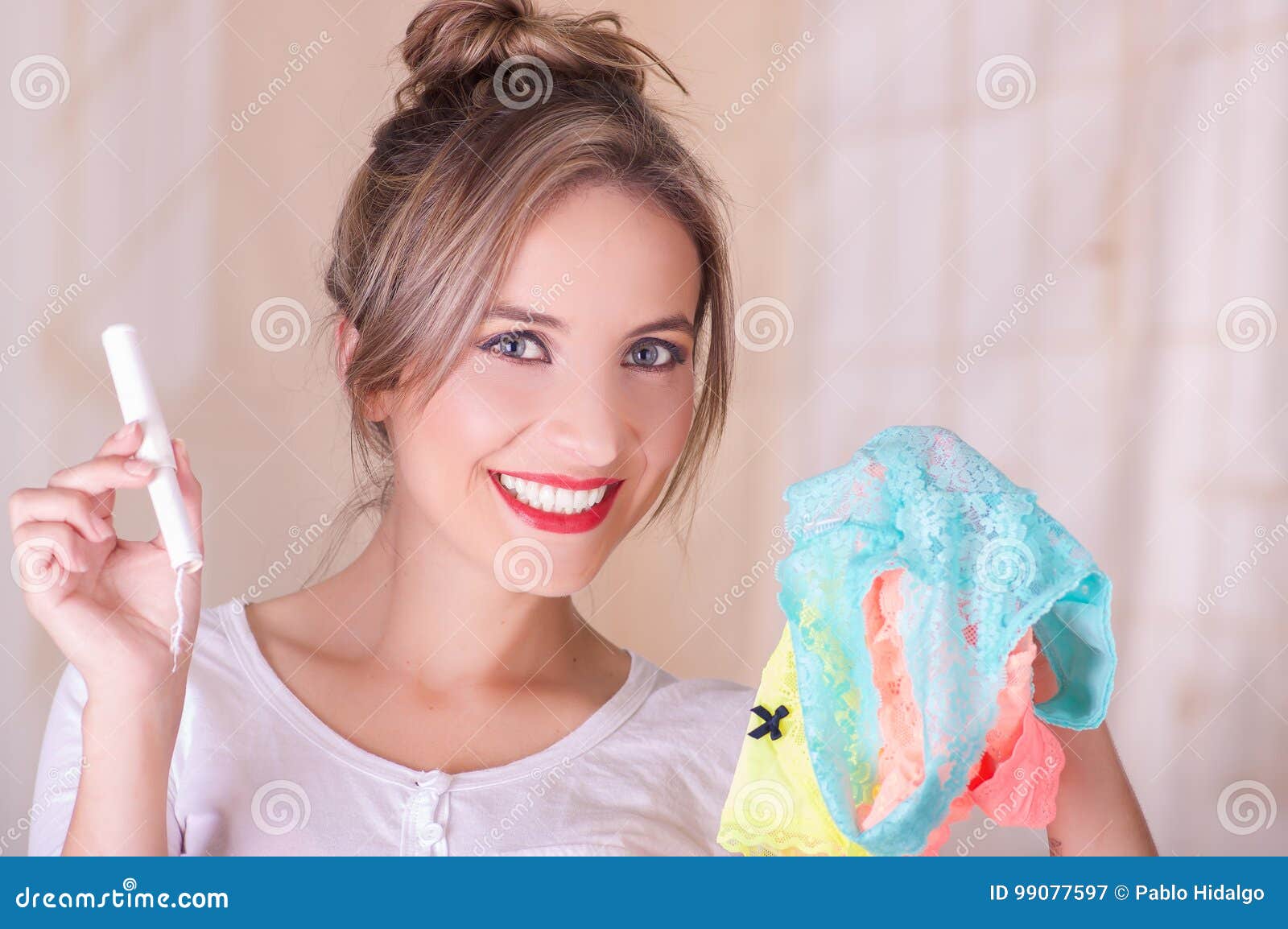 Portrait of Young Beautiful Smiling Woman Holding a Menstruation Cotton ... Portrait of Young Beautiful Smiling Woman Holding a Menstruation Cotton ...