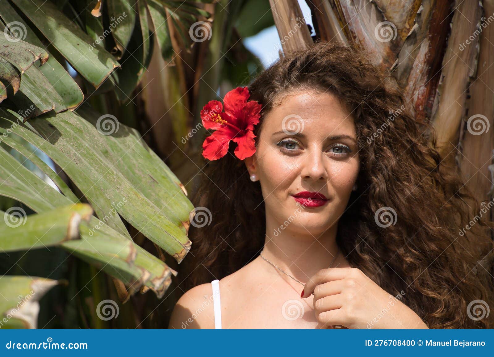 Portrait Of A Young And Beautiful Woman Blonde With Curly Hair And