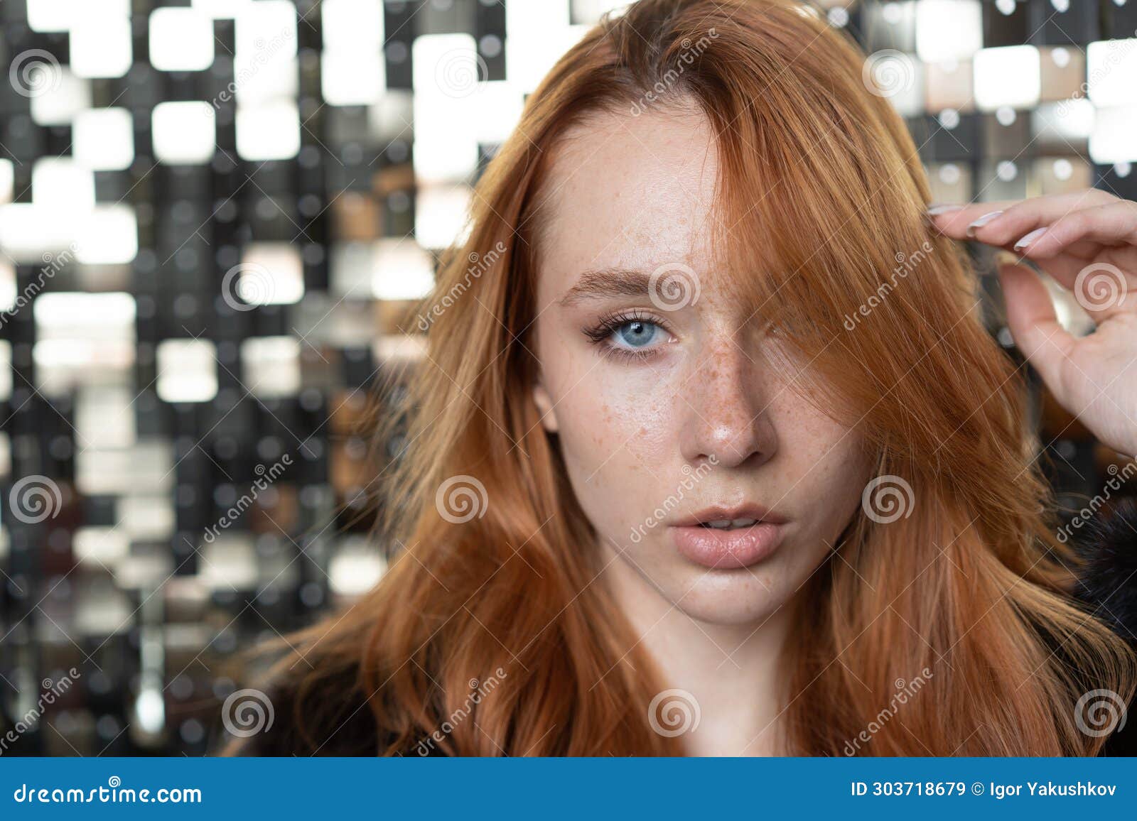 Portrait Of A Young Beautiful Woman With Blue Eyes And Red Hair Stock