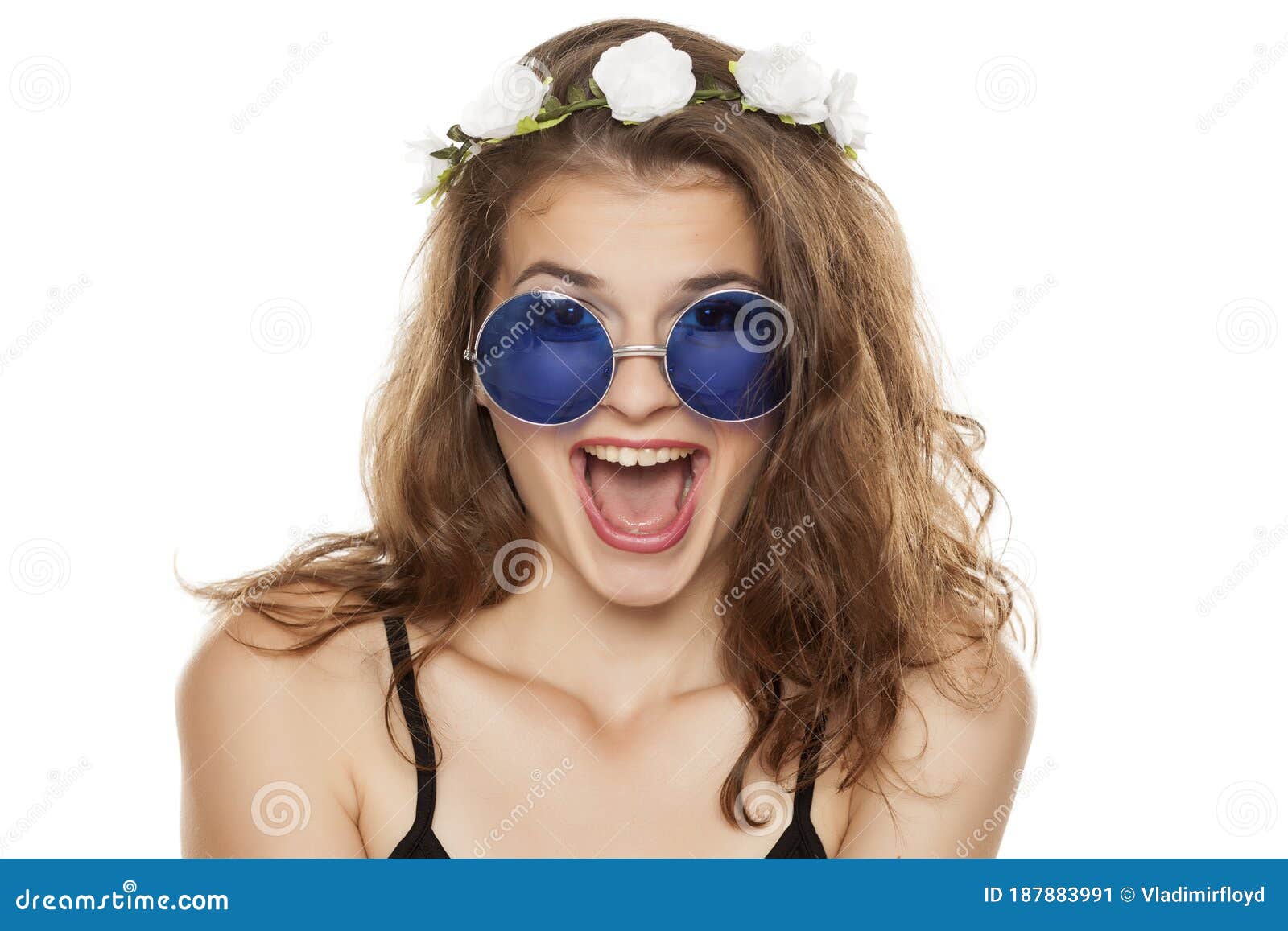 Portrait Of Young Beautiful Woman With Long Curly Hair And Sunglasses