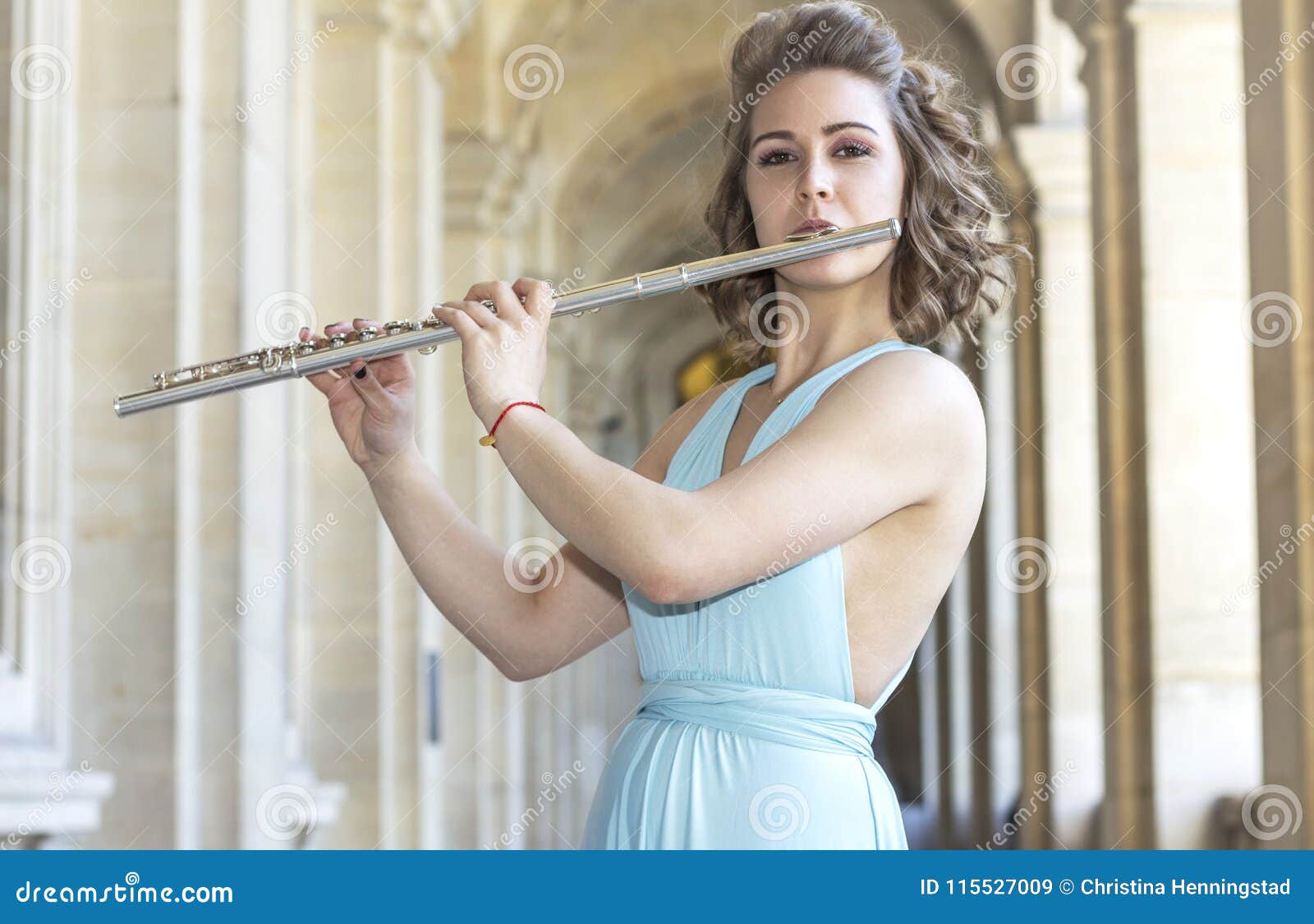Portrait of Young Beautiful Woman Playing Flute. Stock Image - Image of ... Portrait of Young Beautiful Woman Playing Flute. Stock Image - Image of ...