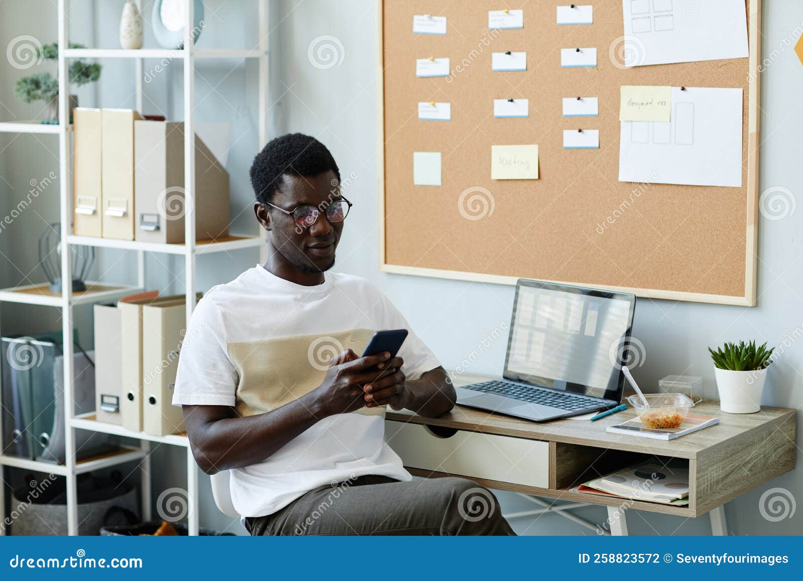 Young Man Using Smartphone at Work Stock Photo - Image of career ...