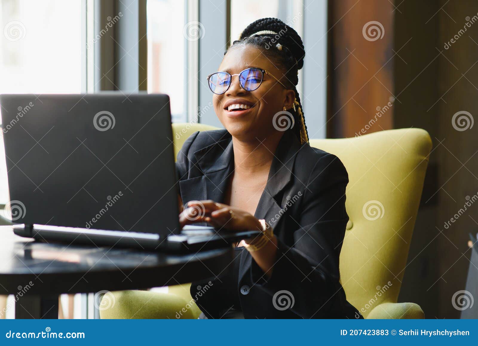 Portrait of a Young Black Woman Smiling and Using Laptop Stock Image ...