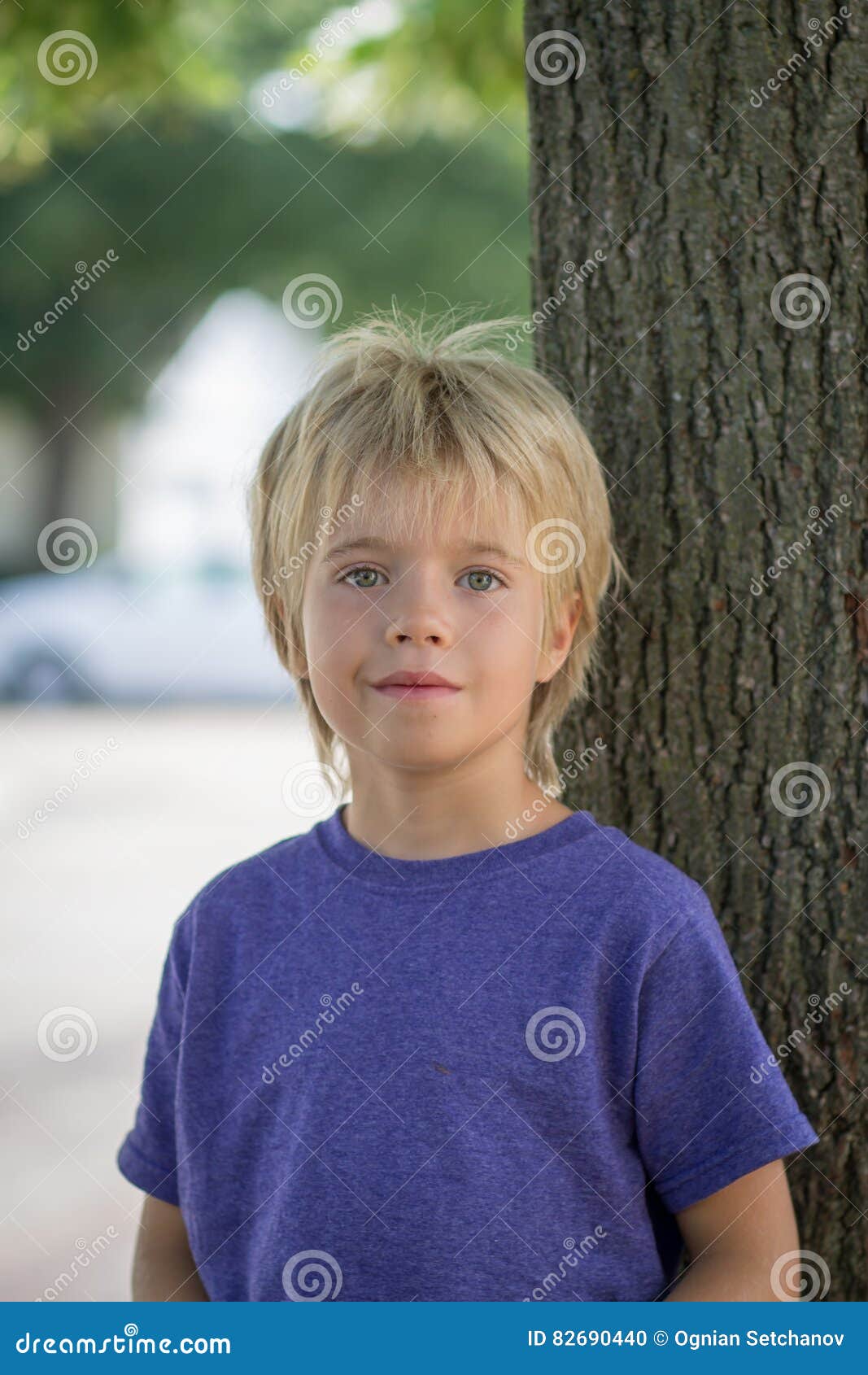 Portrait of a Young Boy in Front of a Tree Stock Photo - Image of ...
