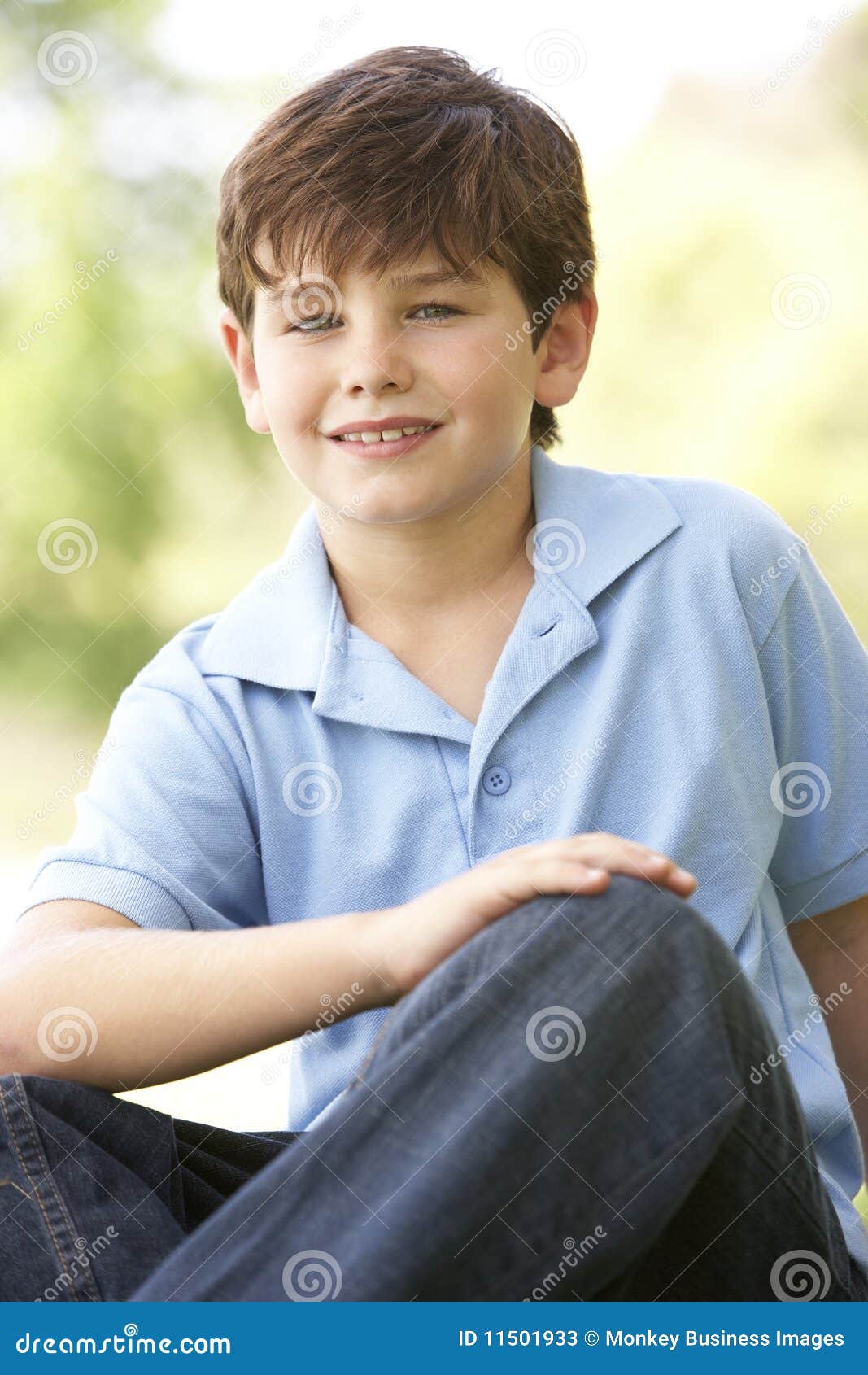 Portrait of Young Boy Sitting in Park Stock Image - Image of outside ...