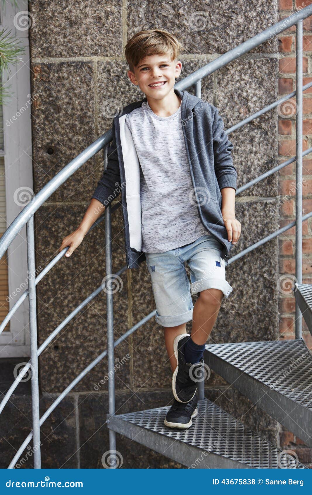 Portrait of a Young Boy on Stairs Stock Photo - Image of confident ...