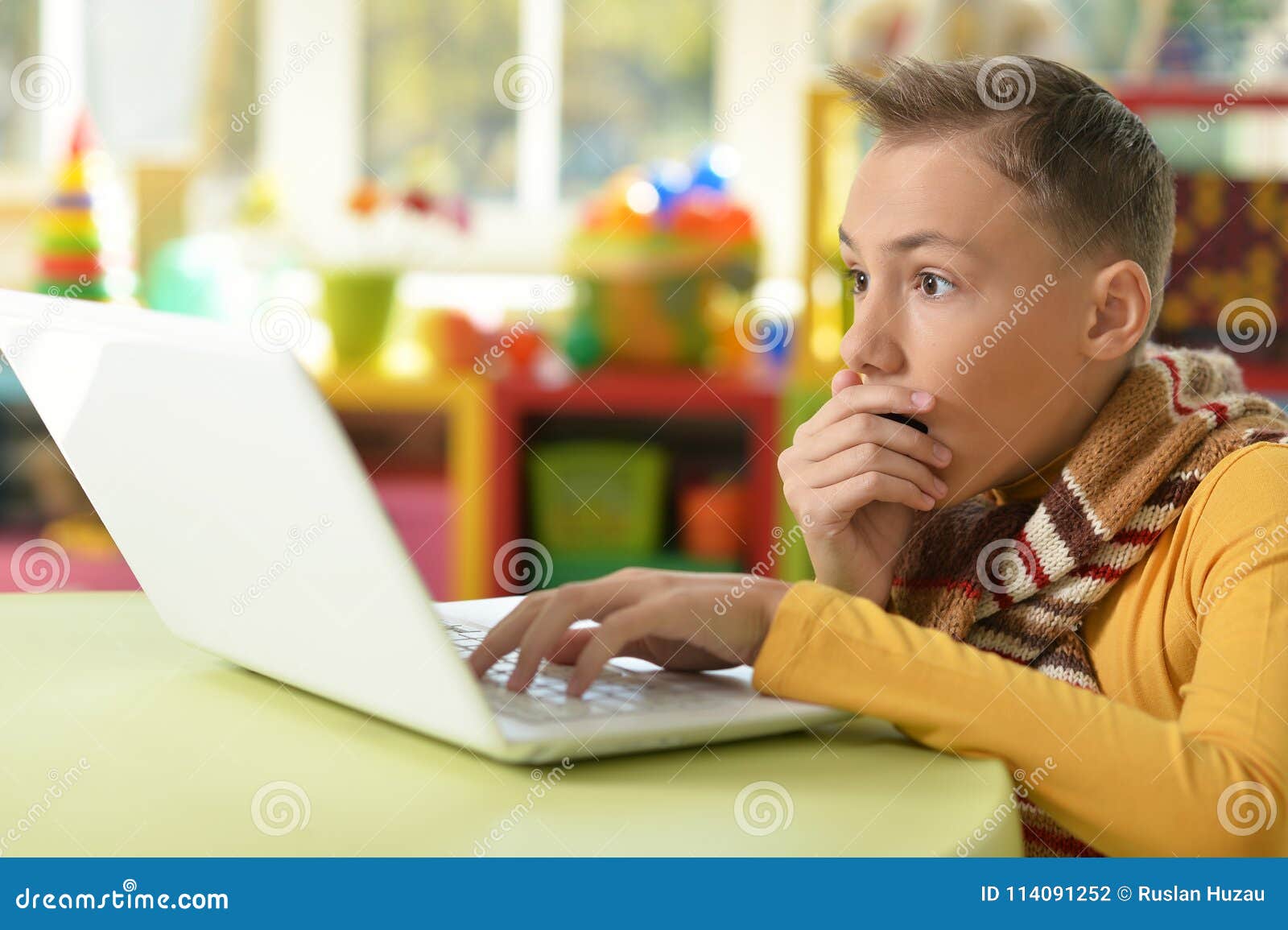 Young boy using laptop stock photo. Image of paper, caucasian - 114091252