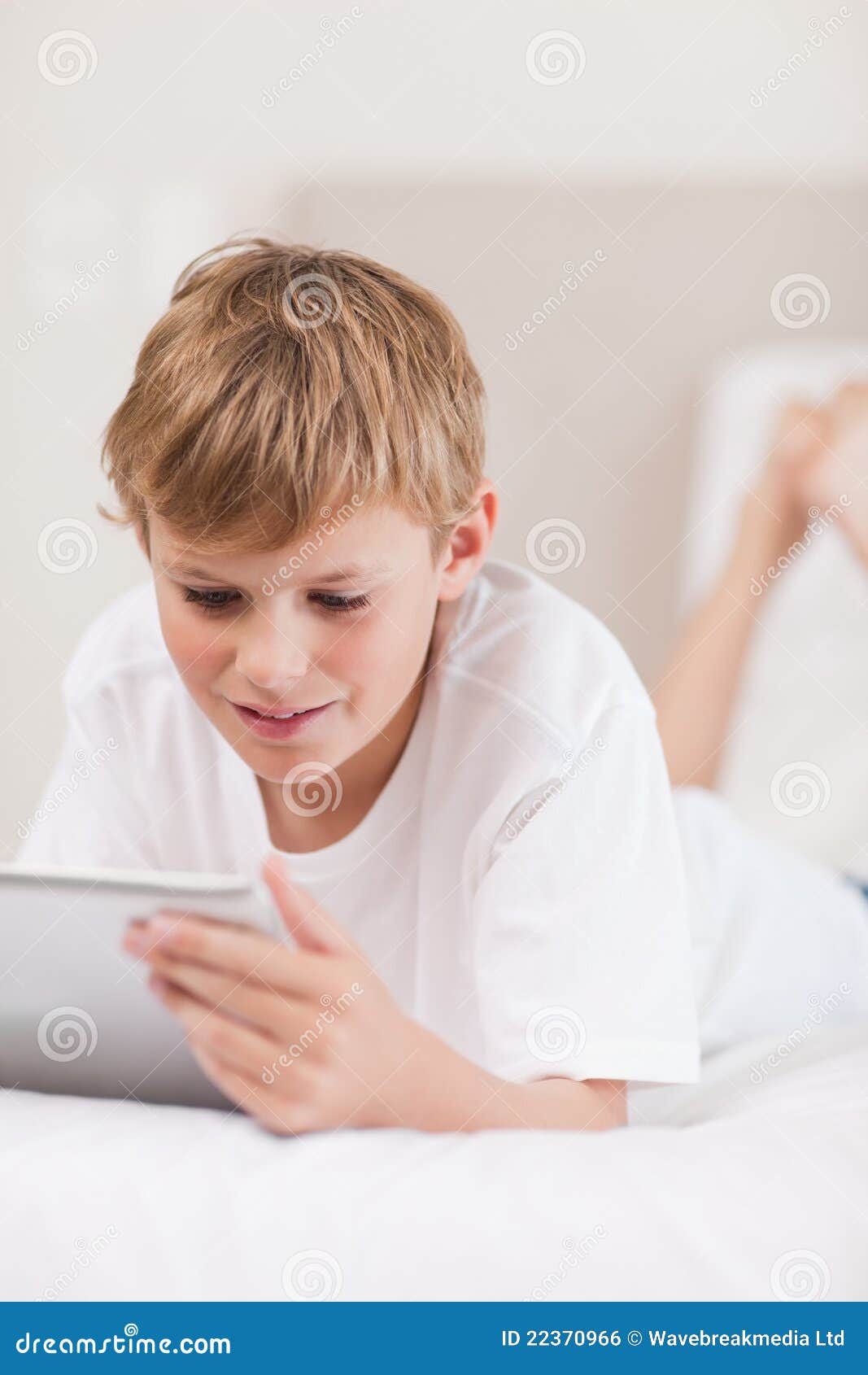 Portrait of a Young Boy Using a Tablet Computer Stock Photo - Image of ...