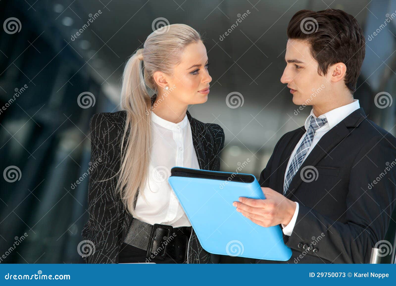 Young Business Couple Talking with File. Stock Image - Image of ...