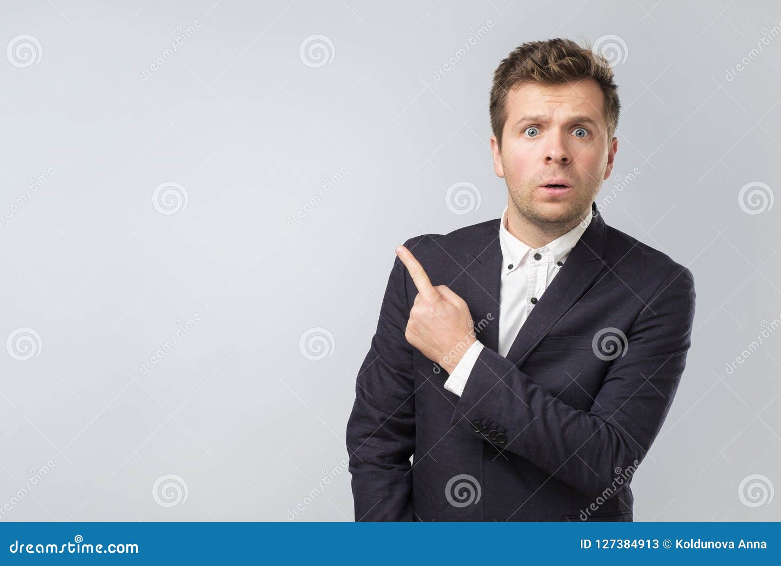 Portrait of a Young Business Man Pointing on Important Information ... Portrait of a Young Business Man Pointing on Important Information ...