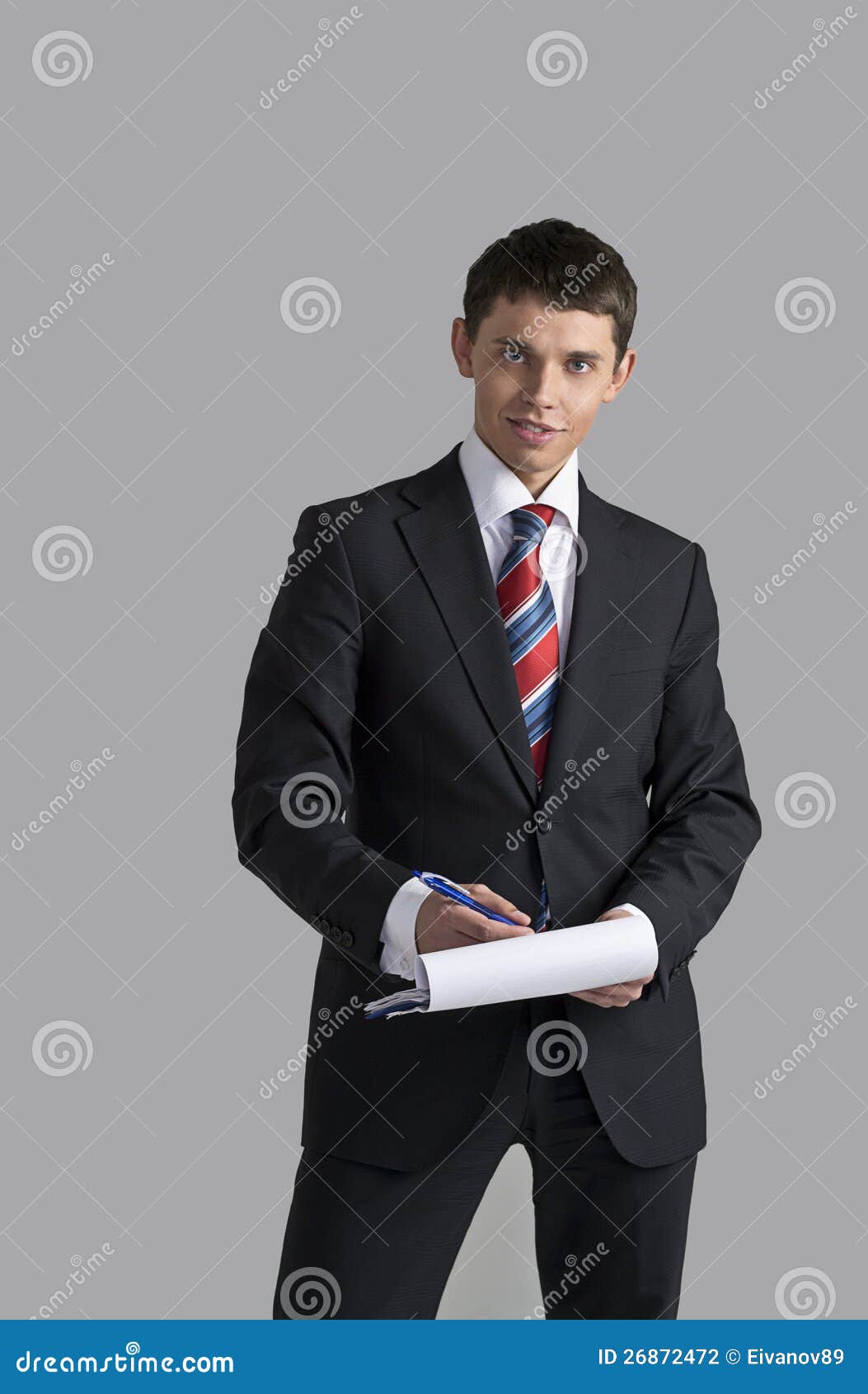 Portrait of a Young Businessman Signing a Document Stock Photo - Image ...