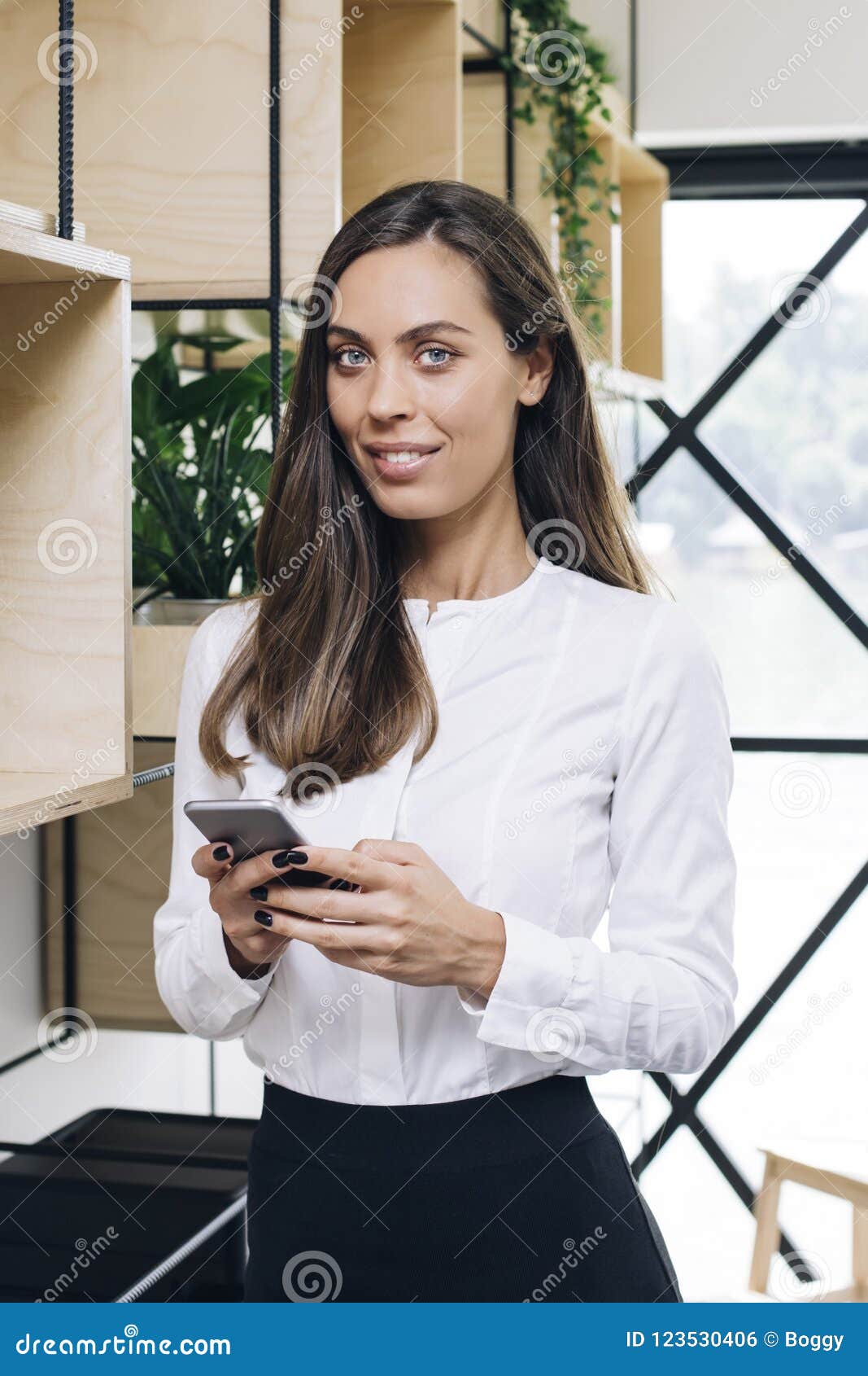 Young Businesswoman Using Mobile Phone in Office Stock Photo - Image of ... Young Businesswoman Using Mobile Phone in Office Stock Photo - Image of ...