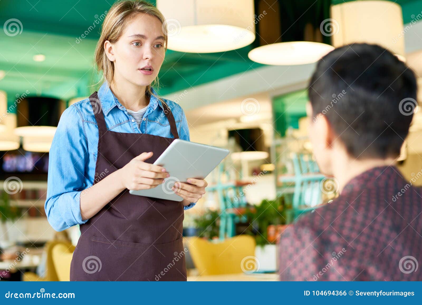 Young Waitress Taking Orders in Cafe Stock Photo - Image of digital ...