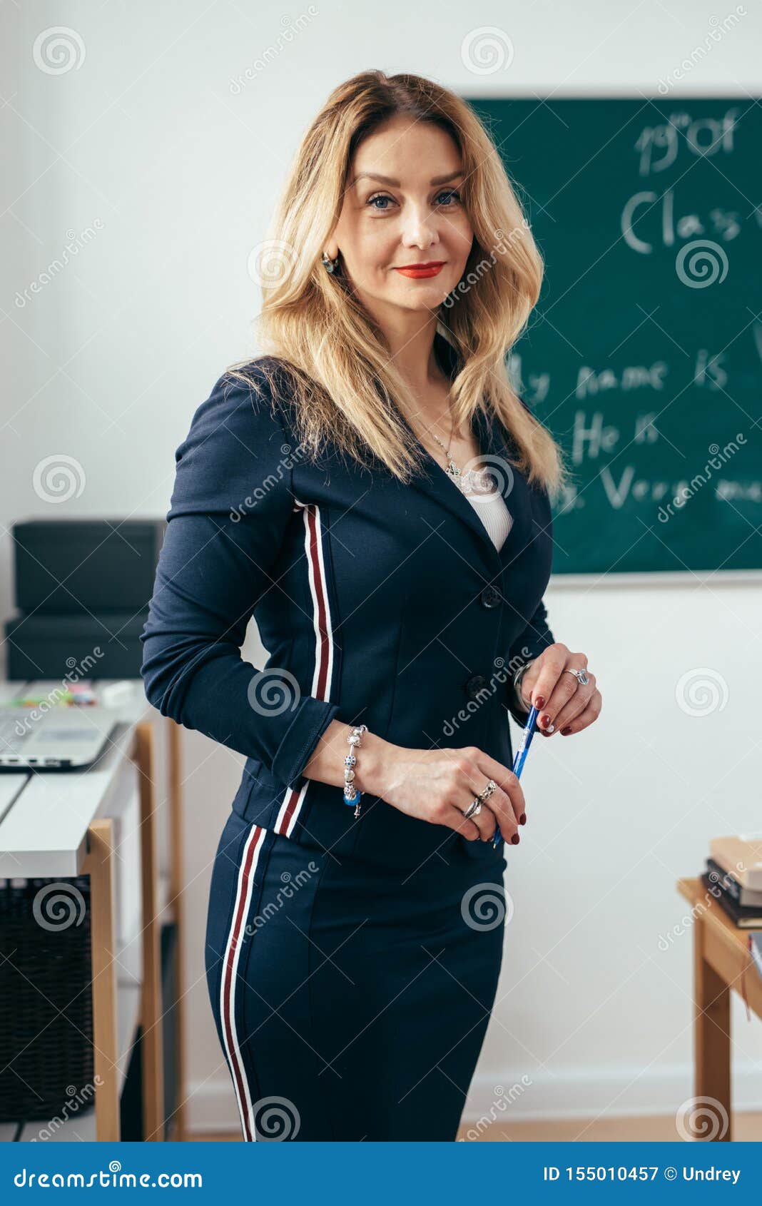 Portrait Of Young Caucasian Female Teacher In School Classroom Stock
