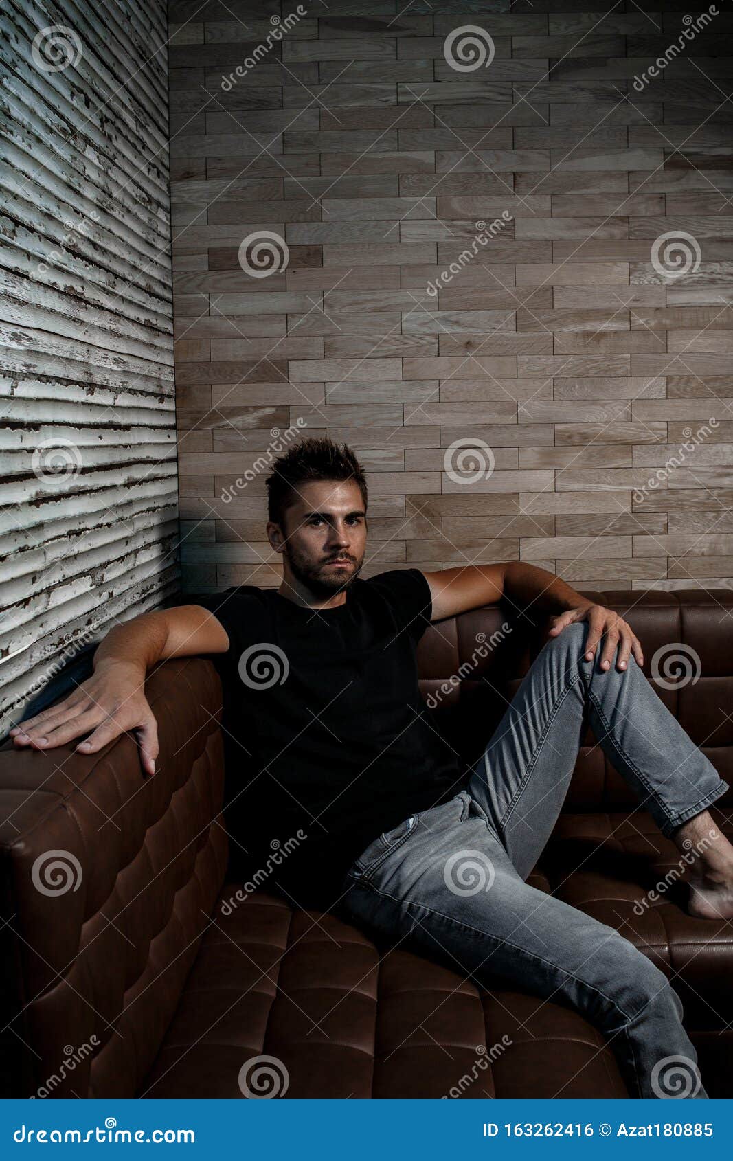 Portrait of a Young Caucasian Guy in a Black T Shirt and Gray Jeans ... Portrait of a Young Caucasian Guy in a Black T Shirt and Gray Jeans ...