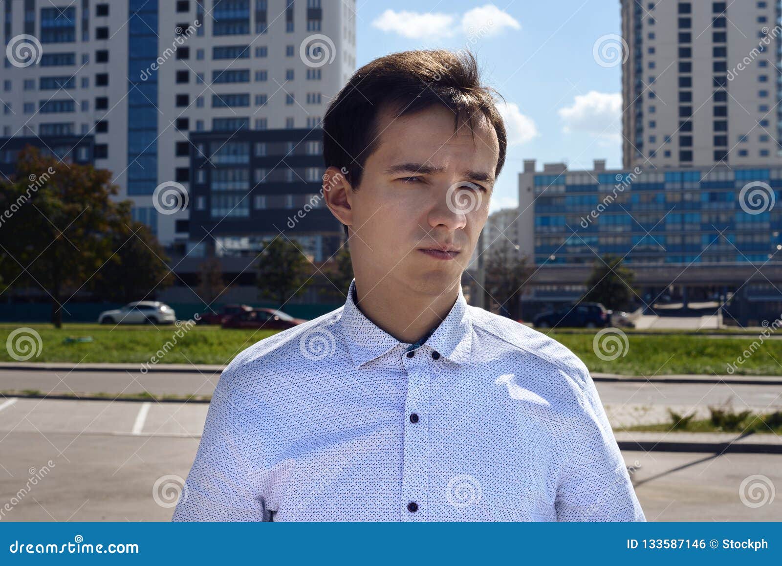 Portrait of a Young Caucasian Guy in Shirt in the City Stock Photo ... Portrait of a Young Caucasian Guy in Shirt in the City Stock Photo ...