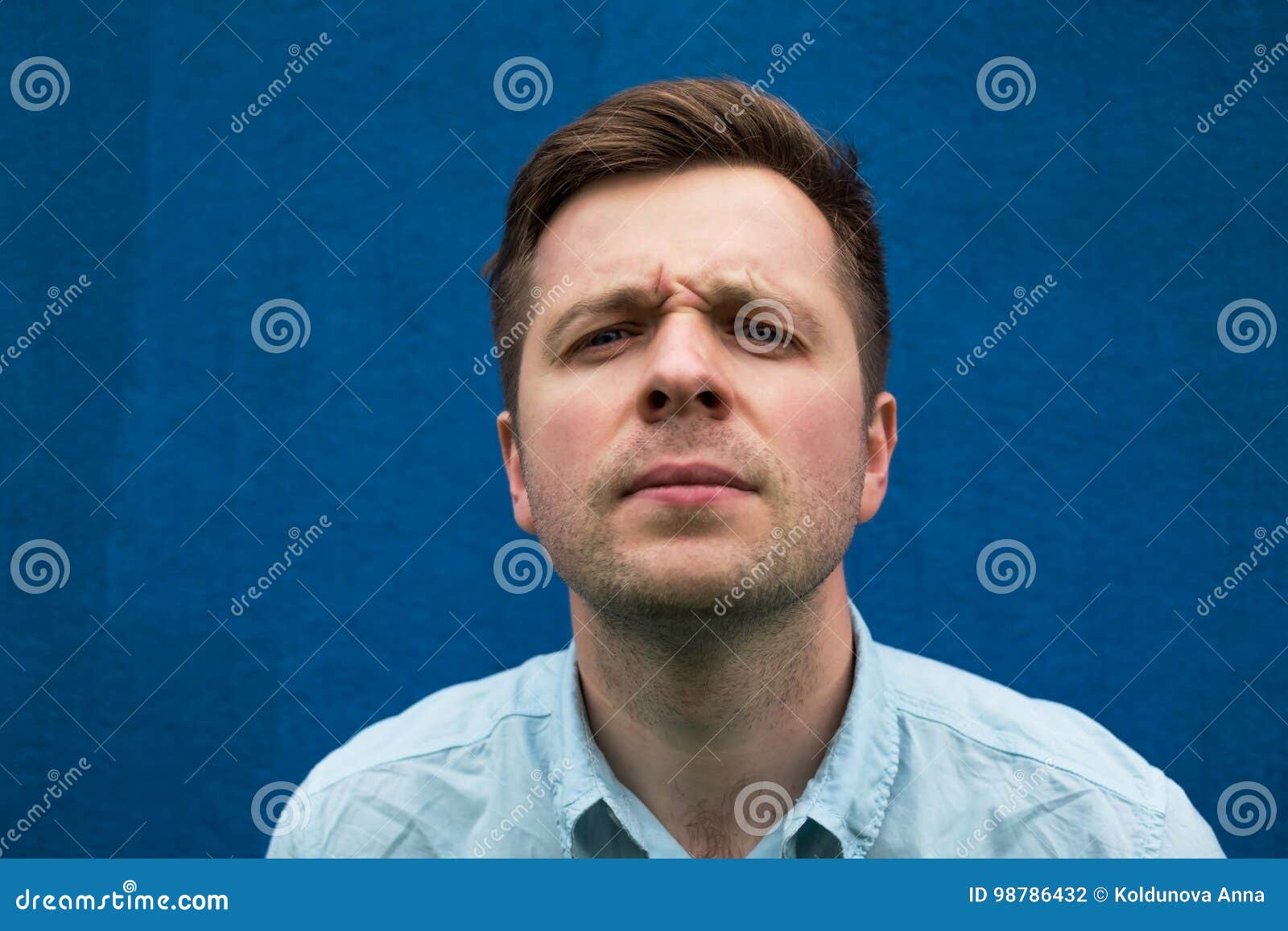 Portrait of Young Caucasian Man Looking Perplexed in Camera. Stock ...